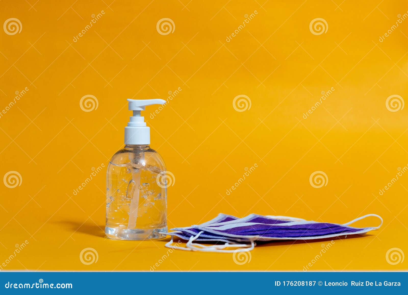 Antibacterial Gel and Respiratory Protection on Yellow Background ...