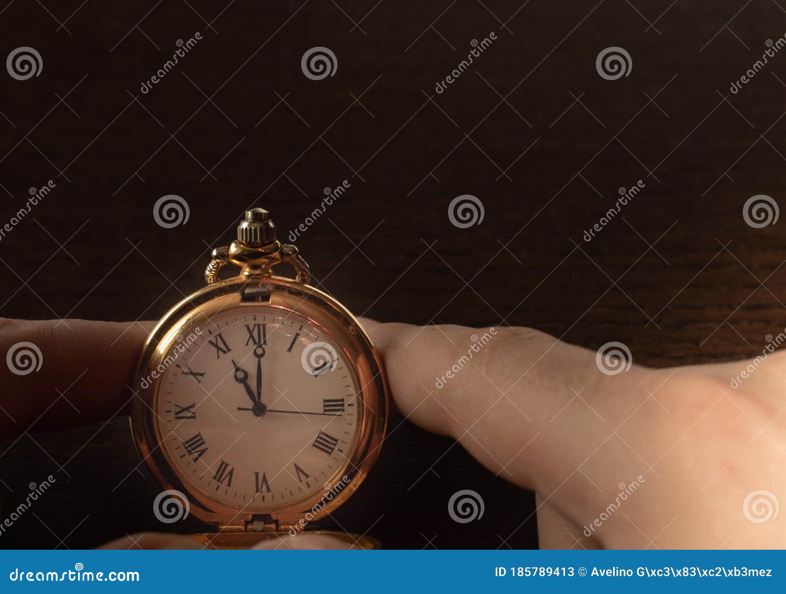 Antique clock on the hands stock image. Image of clock - 185789413
