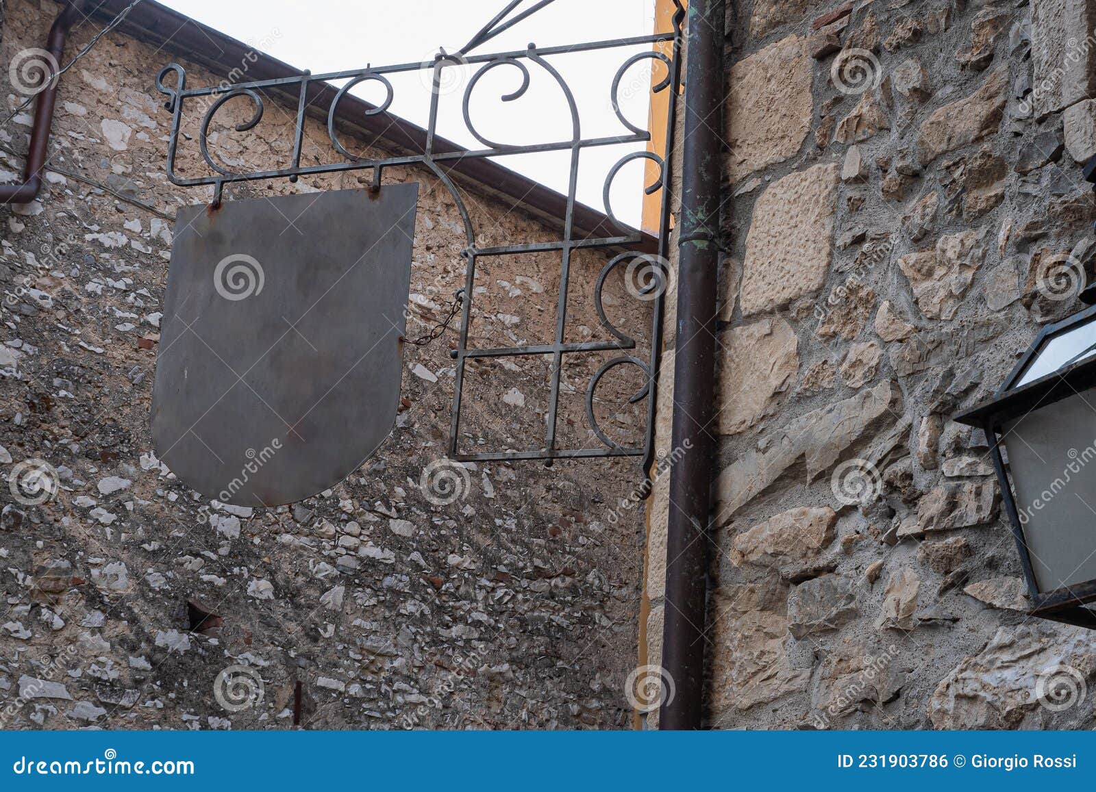 Antique Empty Wrought Iron Sign Hanging on a Wall Stock Photo - Image ...