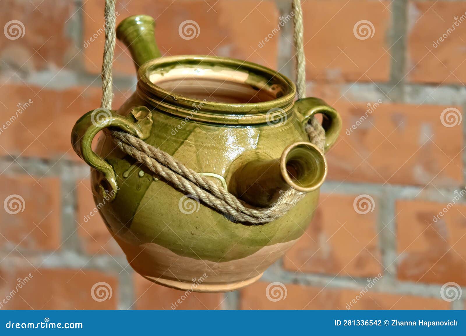 Antique Hanging Jug for Washing Hands on a Brick Wall Background Stock ...