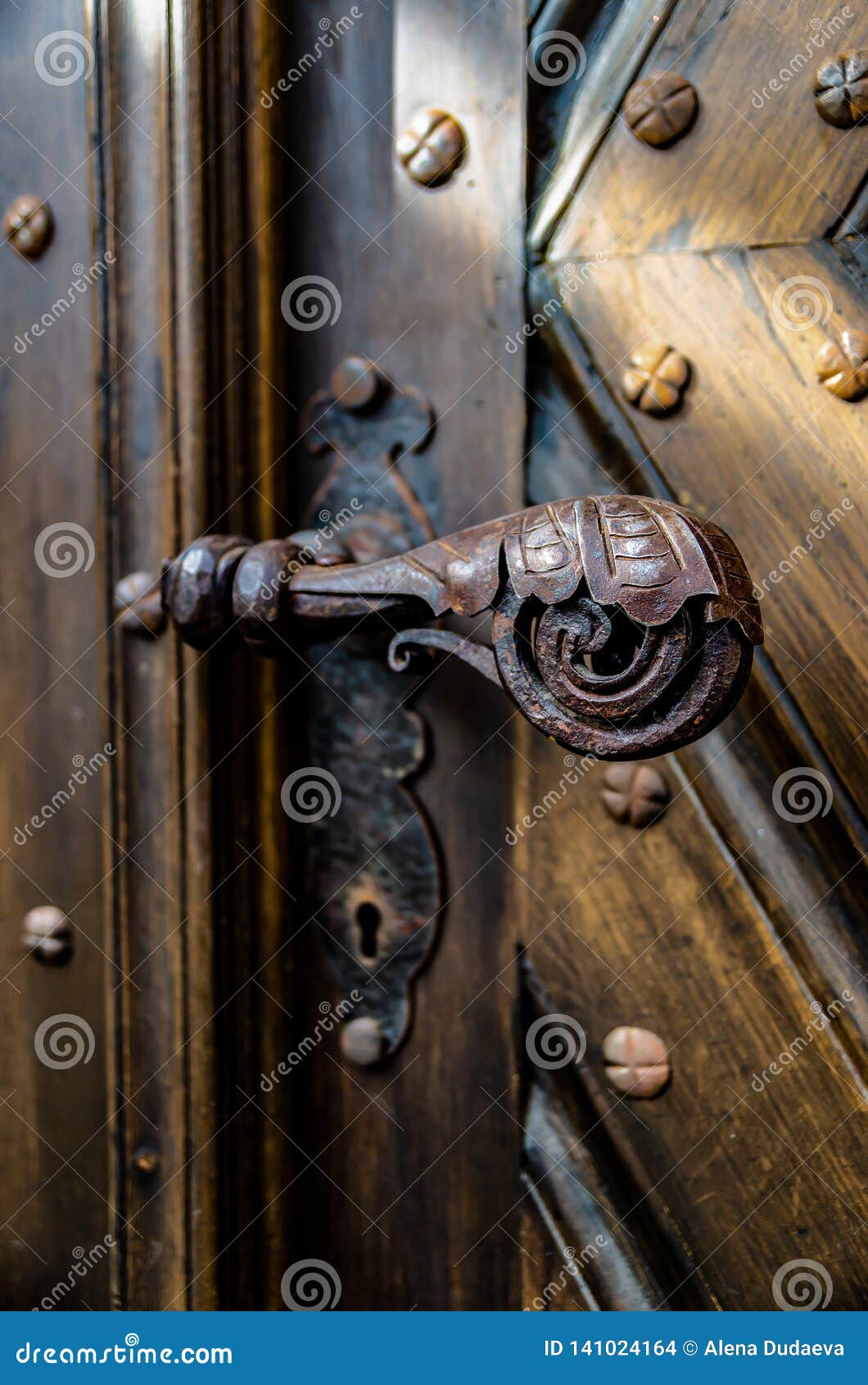 Antique Iron Forged Door Handle from the Front Door Stock Photo - Image ...