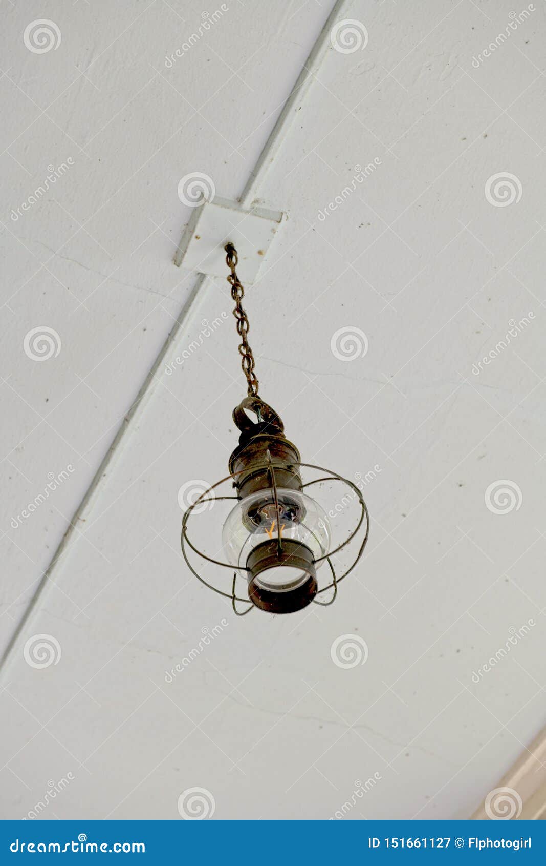 An Antique Light Hanging from a Ceiling Stock Image - Image of light ...