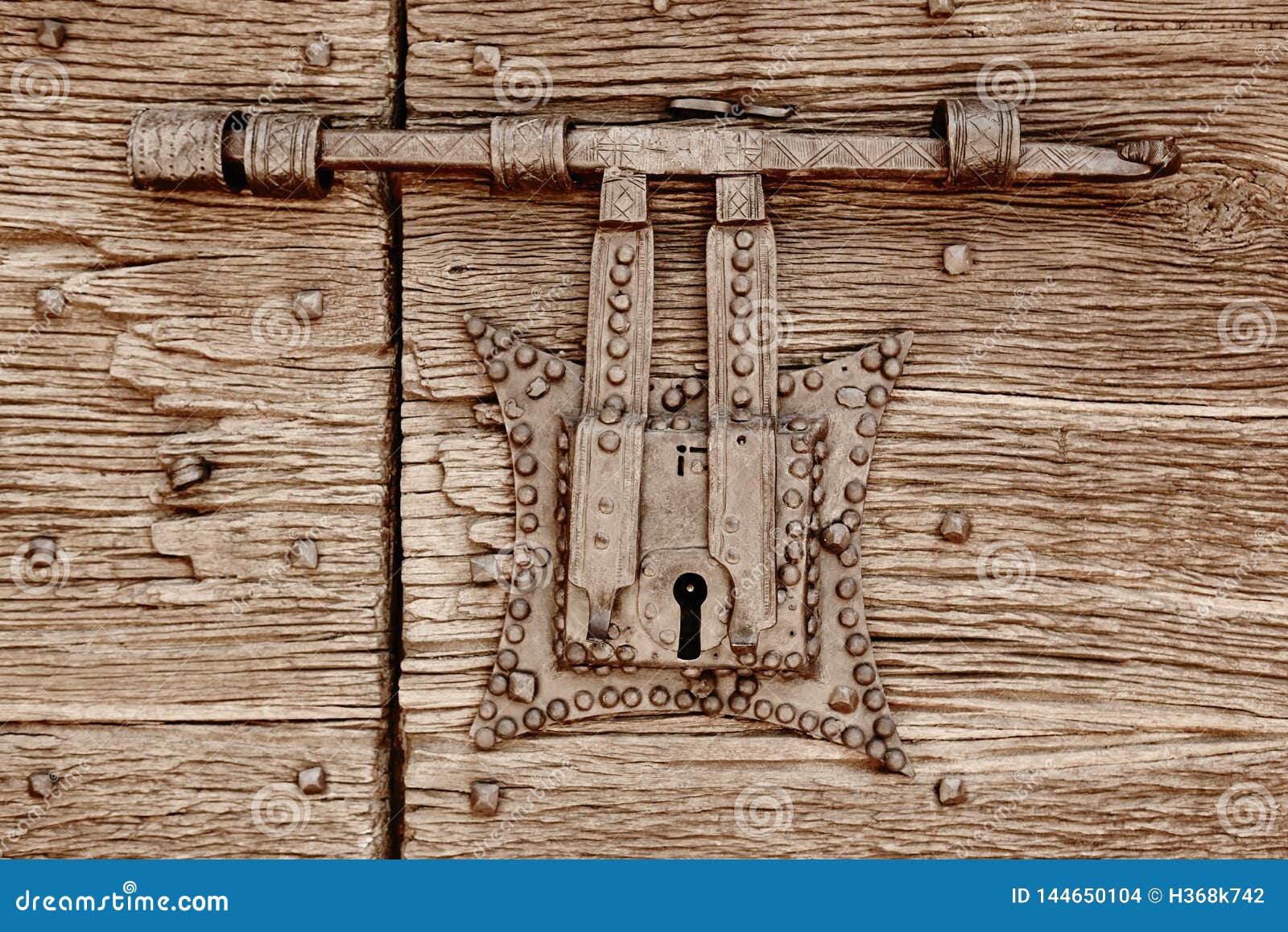 Antique Metallic Door Lock on a Wooden Door Stock Photo - Image of ...