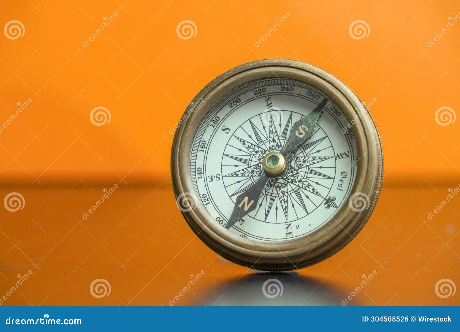 Antique Navigational Compass with an Orange Background. Stock Photo ...