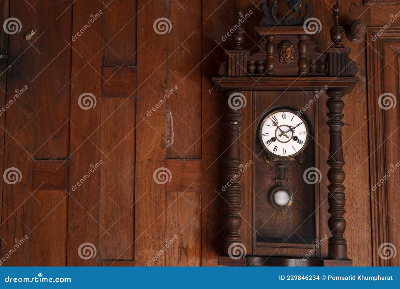 Antique Pendulum Clock Hanging on the Wooden Wall Stock Photo - Image ...