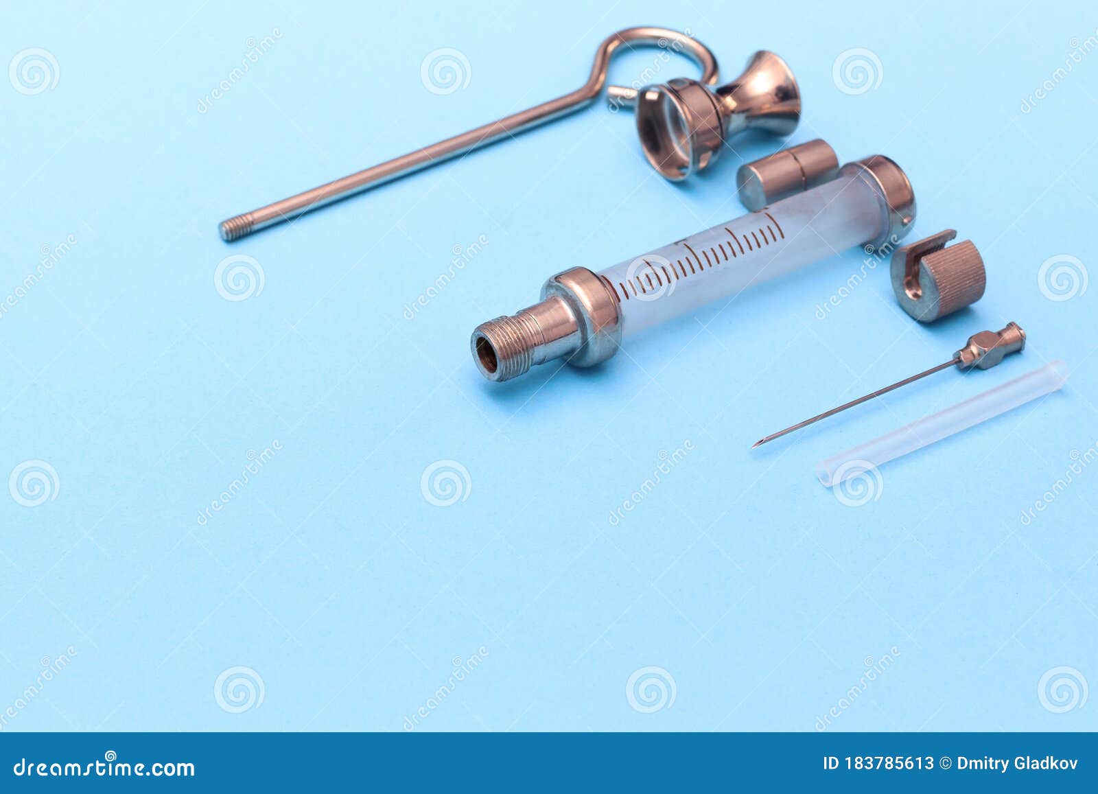 Antique Syringe Disassembled into Details on Blue Background Stock ...