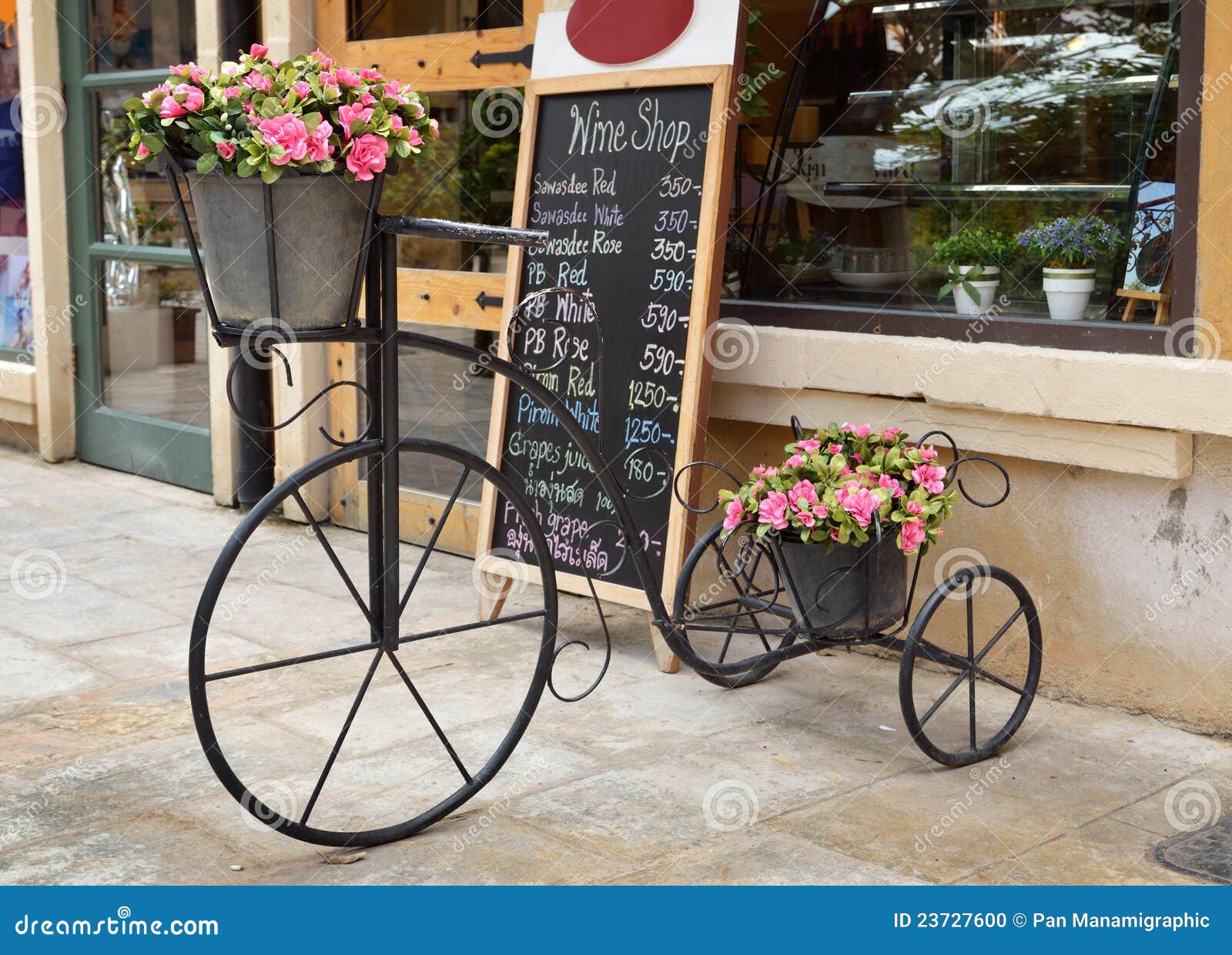 Antique Tricycle and Artificial Flowers Stock Photo - Image of flower ...