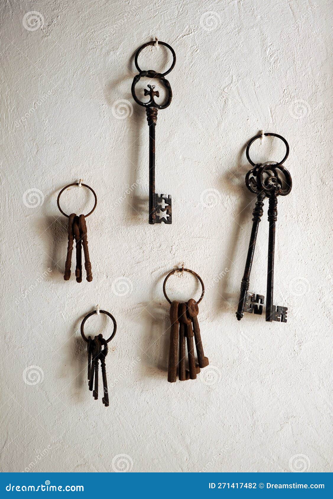 Antiques Iron Keys Hanging on a House Whitewashed Wall Stock Photo ...