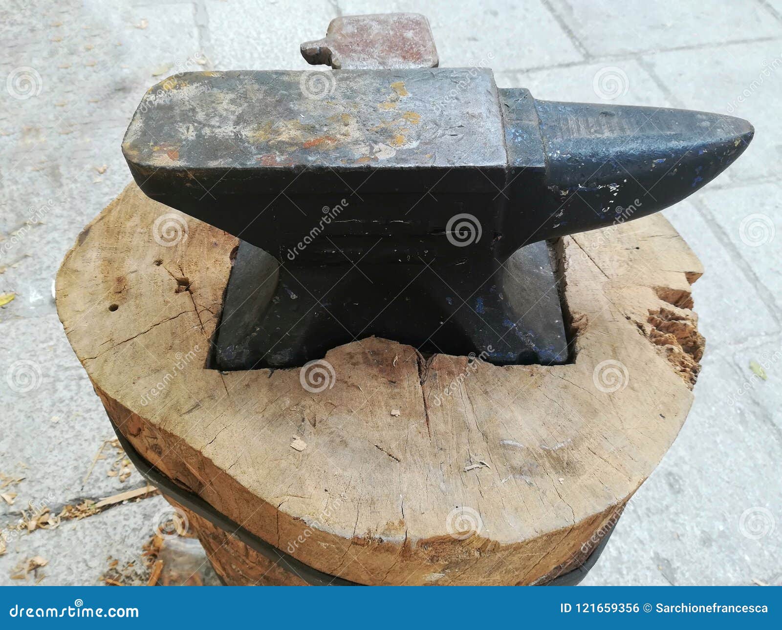 Anvil resting on a log stock photo. Image of anvil, vintage - 121659356
