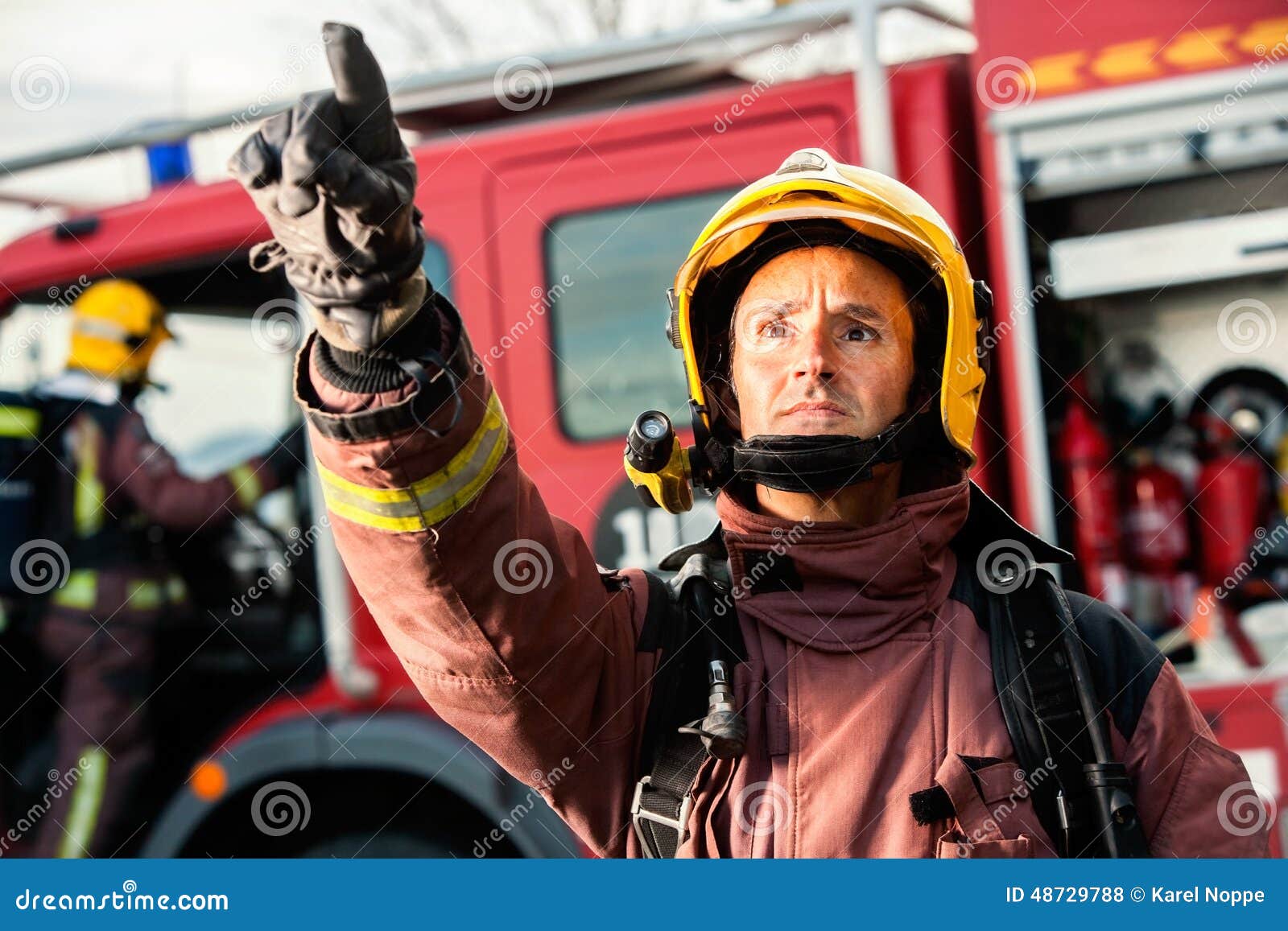 Anxious Fireman Pointing at Fire. Stock Photo - Image of expression ...