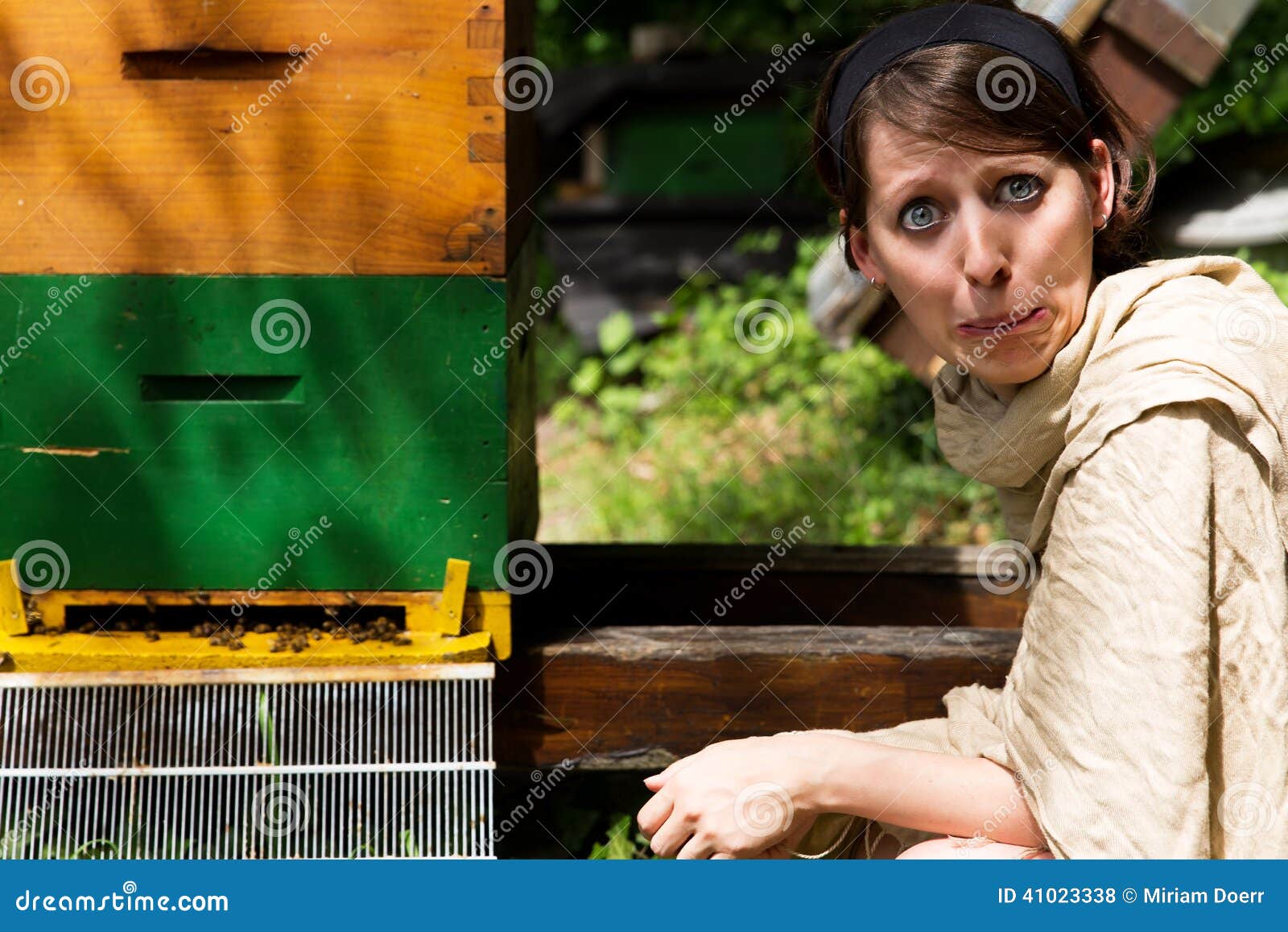 Anxious Woman Sitting on a Beehive Stock Photo - Image of bees ...
