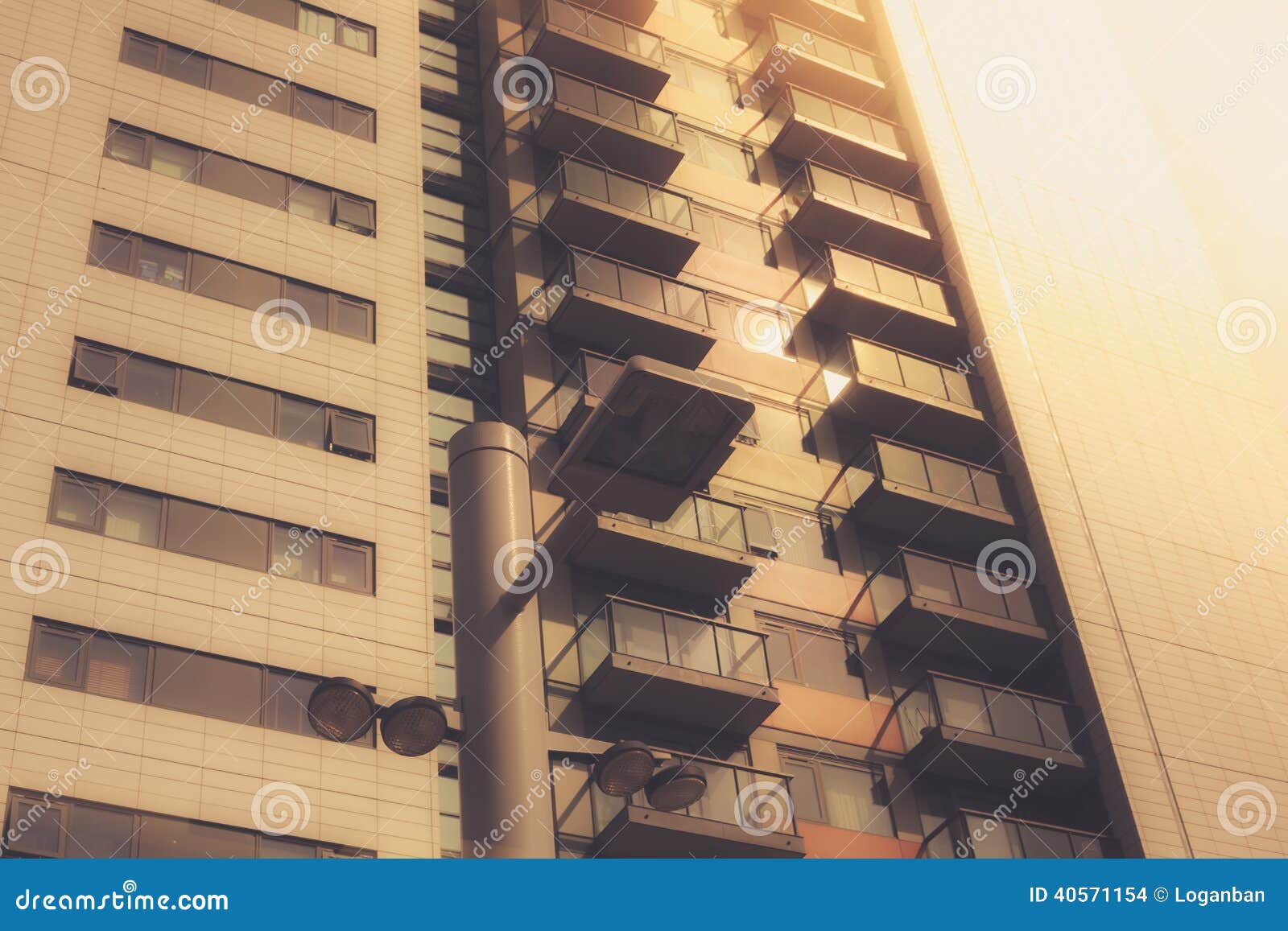 Apartment block at sunset stock photo. Image of night - 40571154