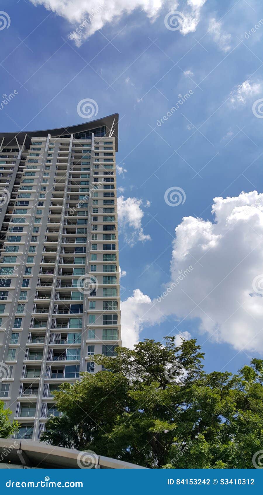 Apartment Building and Beautiful Clouds. Stock Photo - Image of ...
