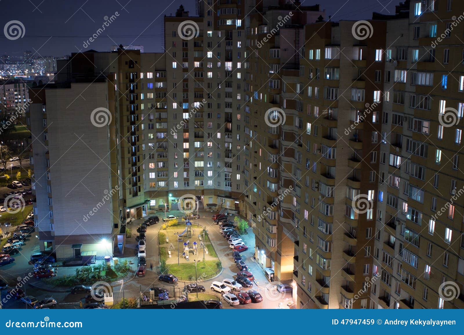 Apartment Building at Evening Time with Light in Windows on Facade ...