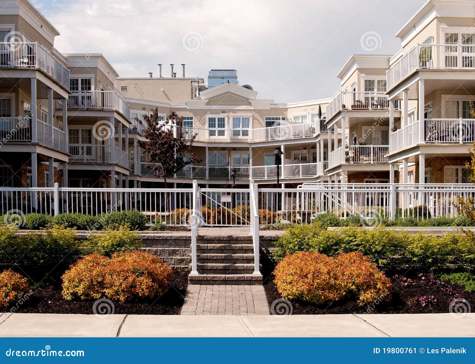 Apartment Complex stock image. Image of shrub, cloud - 19800761