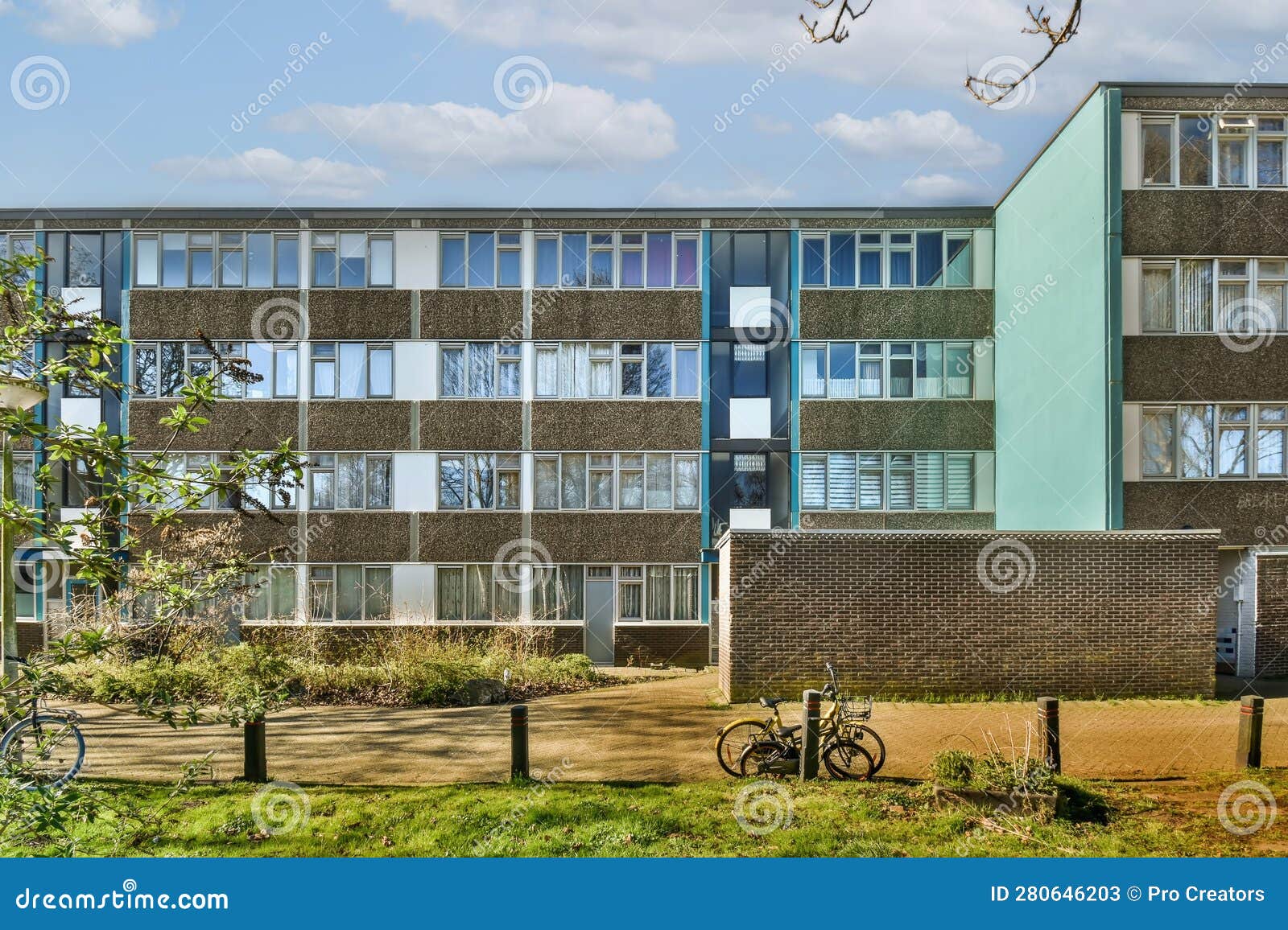 A Building with Two Bikes Parked Outside of it Stock Image - Image of ...