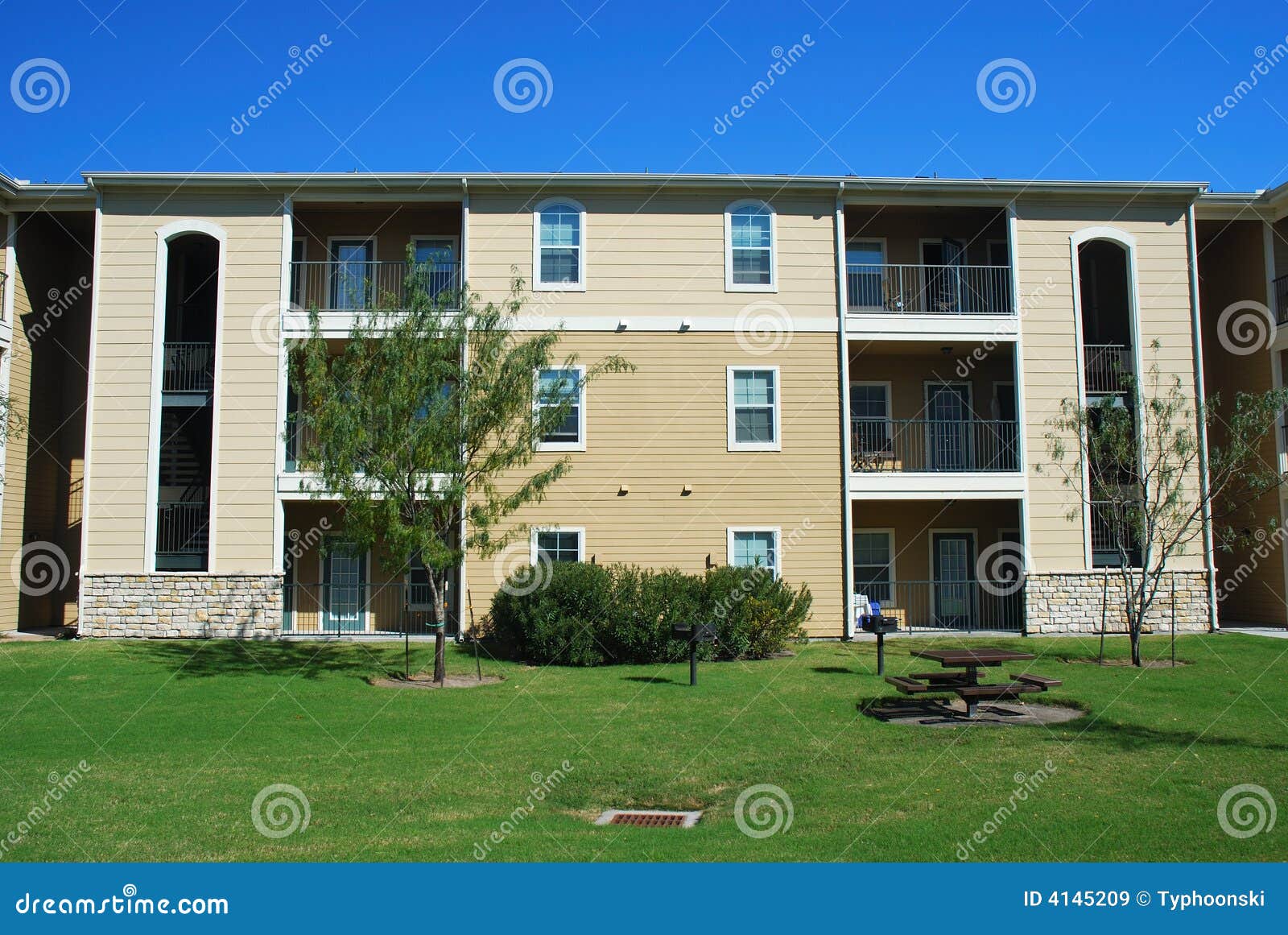 Apartment house stock image. Image of patio, green, realty - 4145209