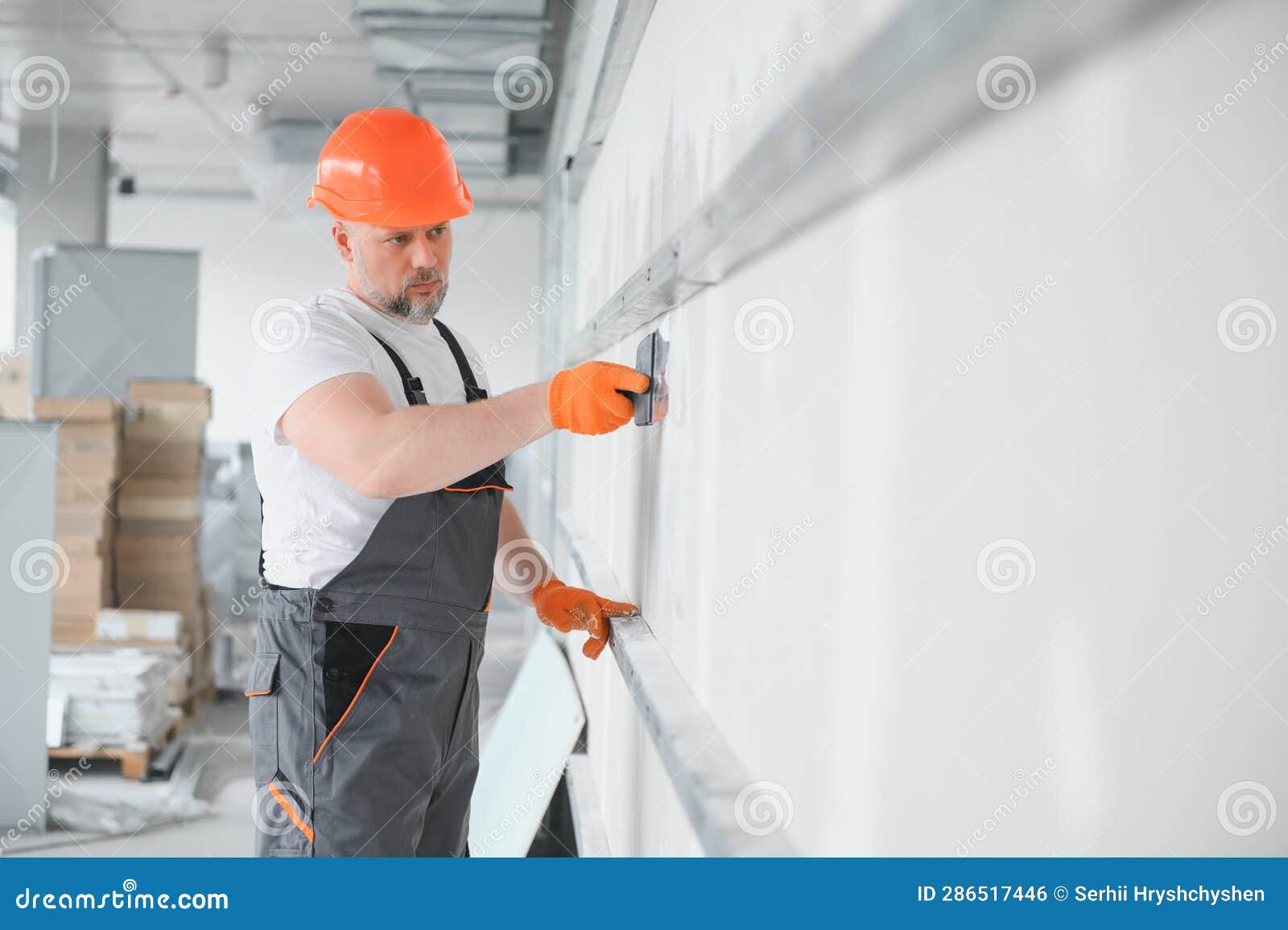 Apartment Interior Construction - Worker Plastering Gypsum Board Wall ...