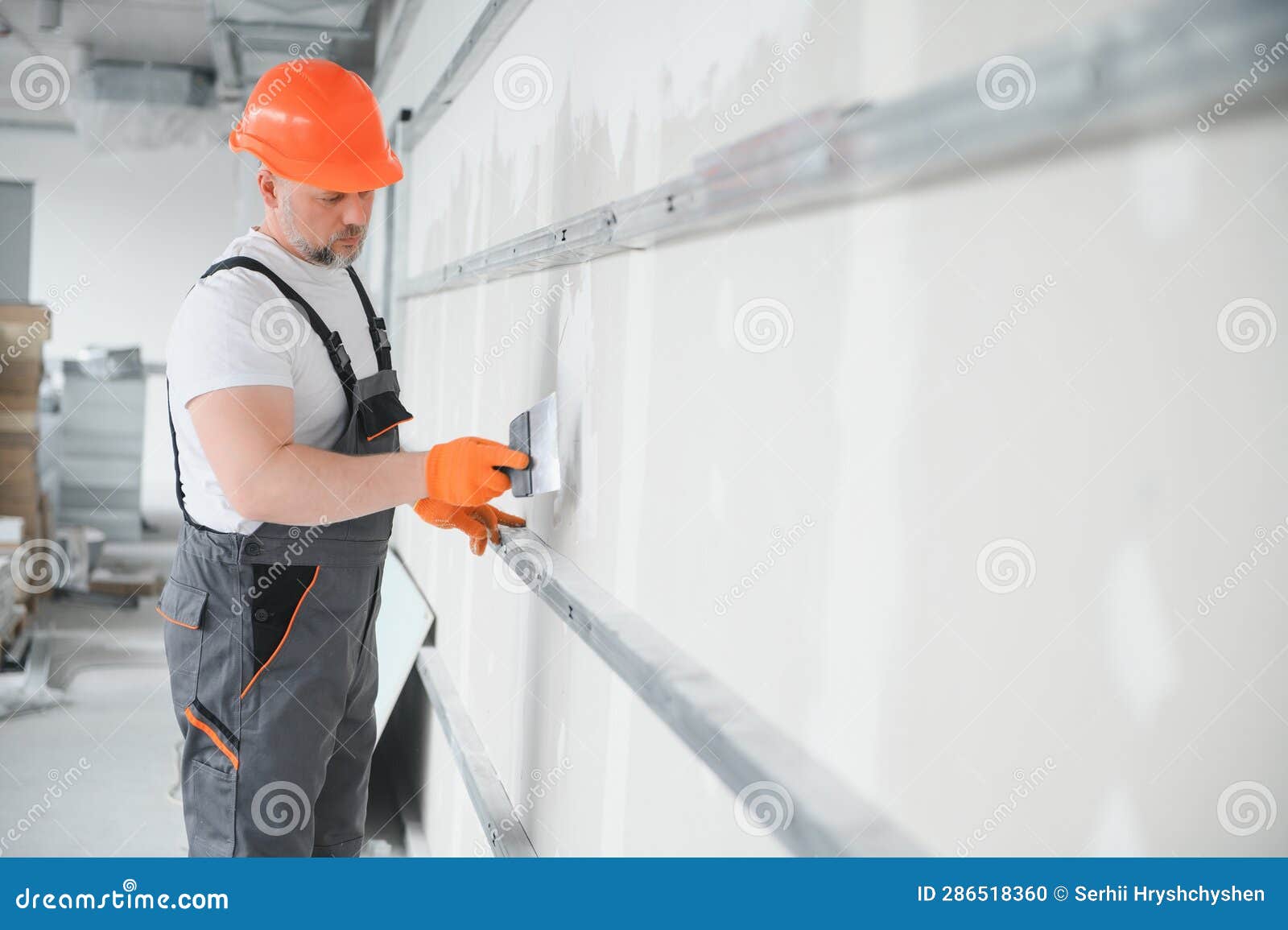 Apartment Interior Construction - Worker Plastering Gypsum Board Wall ...