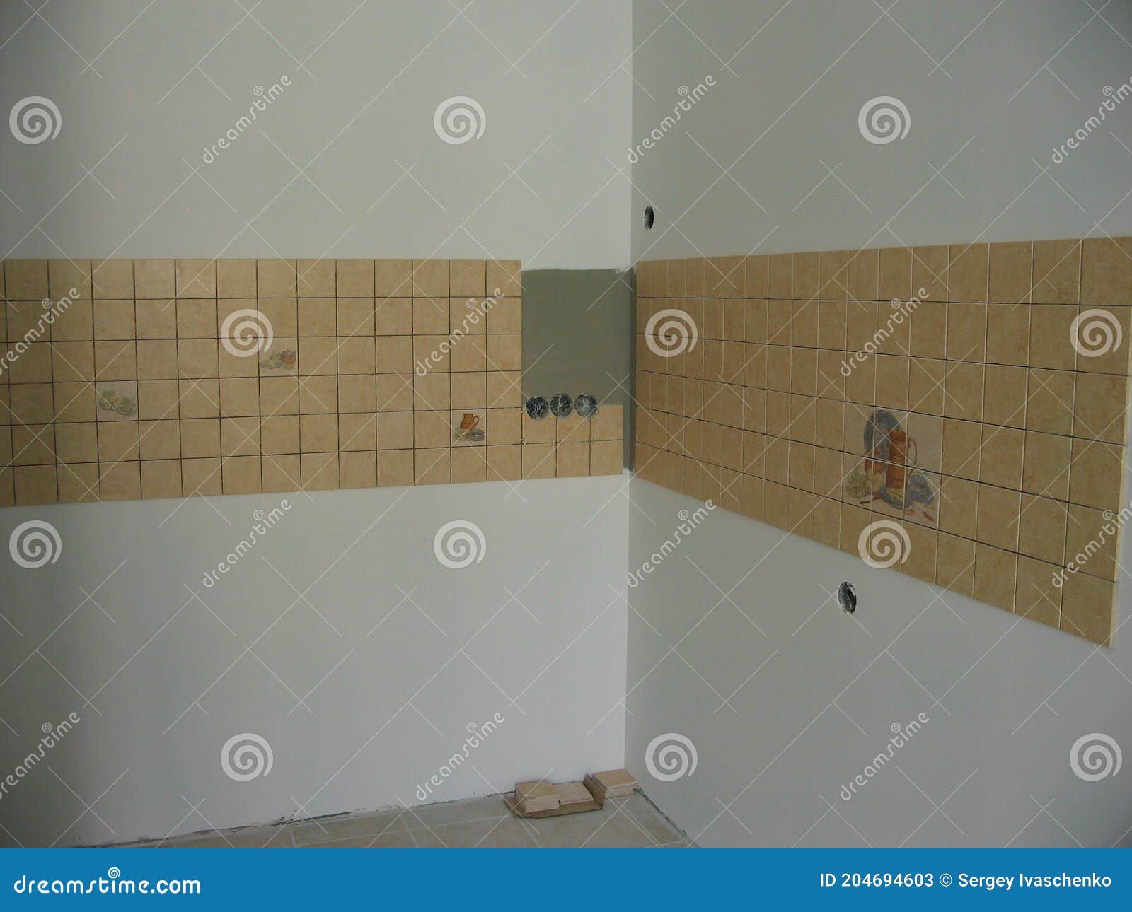 Kitchen Apron Lined with Wall Tiles with Drawings. Stock Image - Image ...