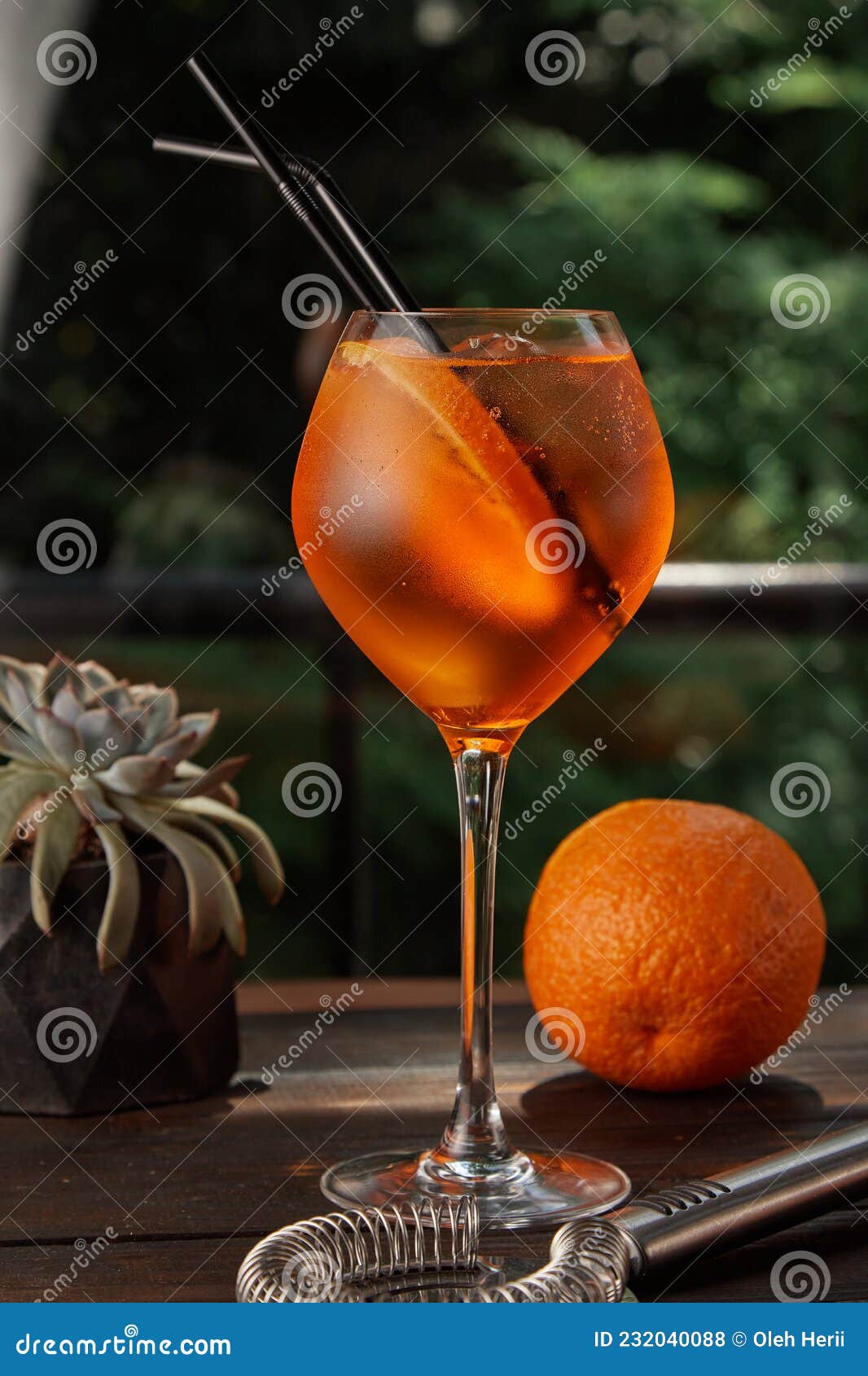 Aperol Spritz on a Background of Green with Orange Stock Photo - Image ...