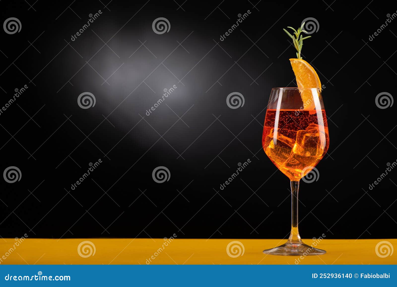 An Aperol Spritz with Ice on the Table Stock Photo - Image of black ...