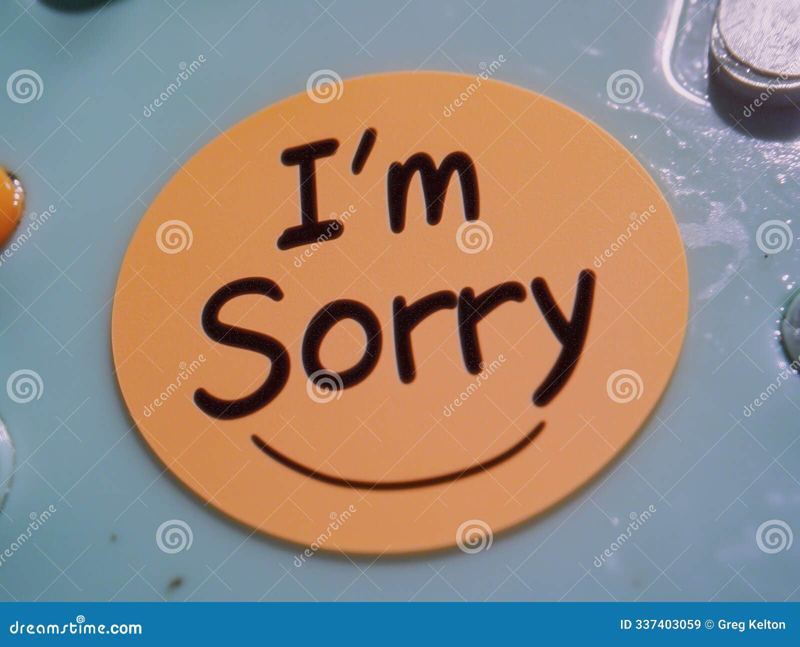 Apology Note on a Colored Sticker Placed on a Blue Surface with a ...