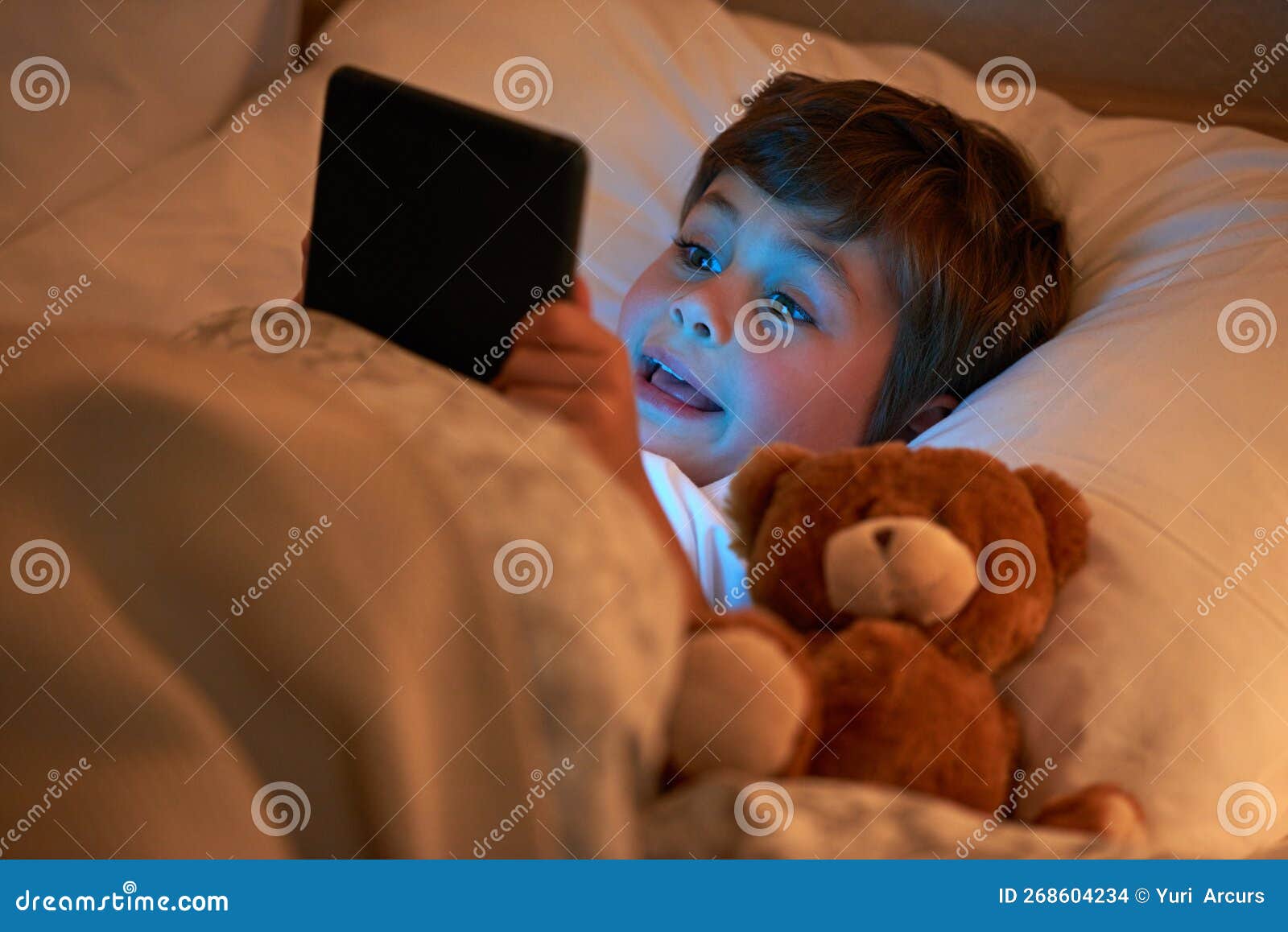 This App Has so Many Bedtime Stories To Choose from. a Young Boy Using ...