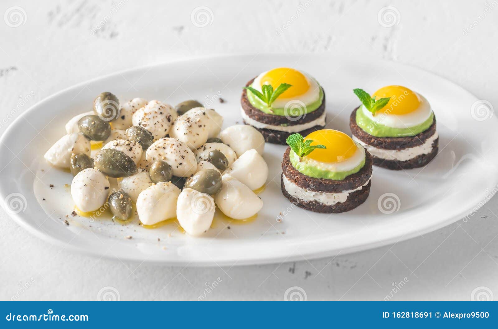 Appetizer with Canape, Mozzarella and Capers Stock Image - Image of ...