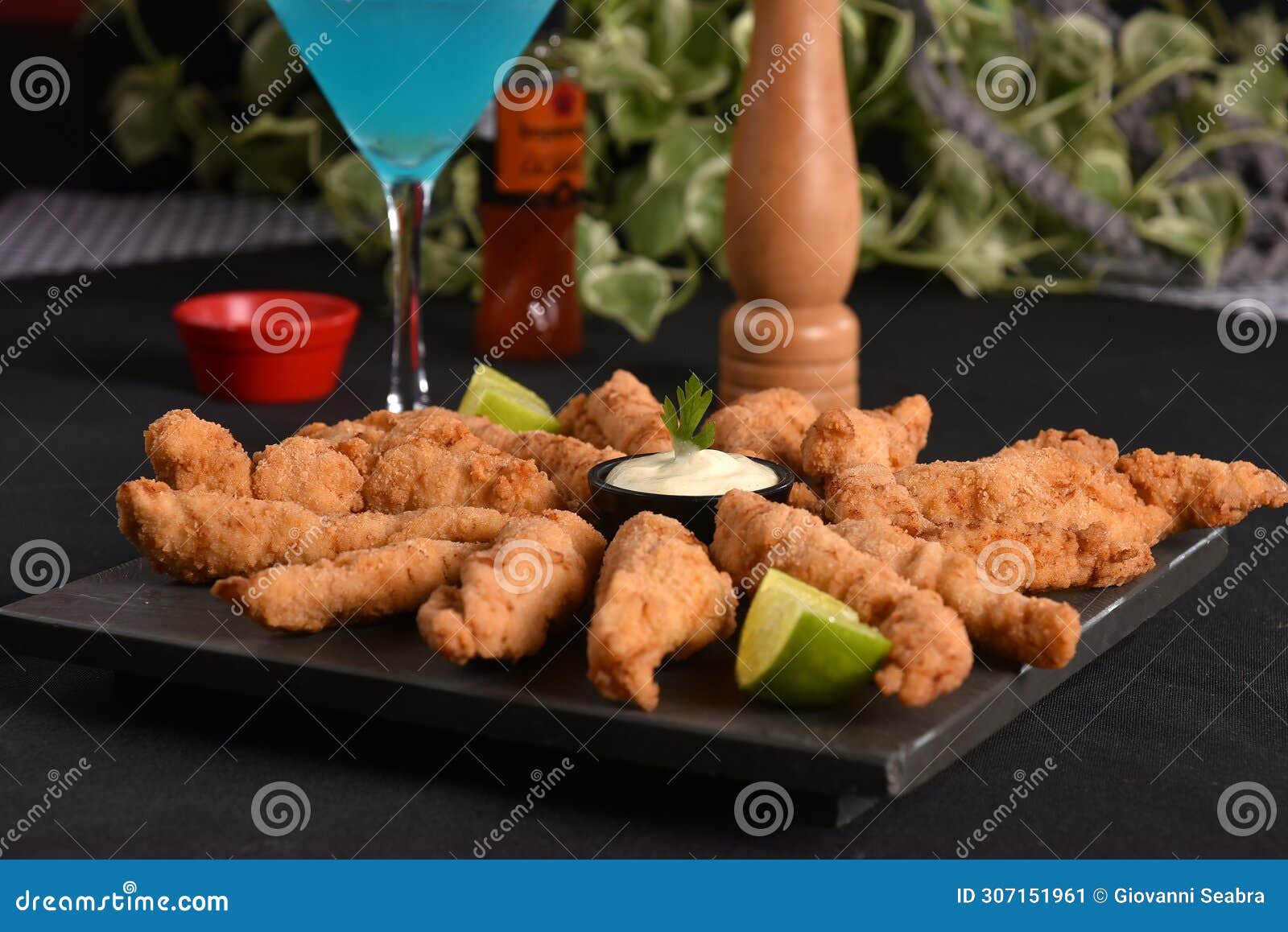 Appetizer of Fried Chicken Strips Breaded with Herb and Lemon Sauce ...