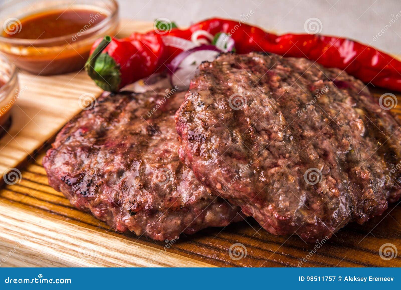 Appetizing Fried Beef Cutlet, Decorated with Herbs, Pepper, with Sauce ...