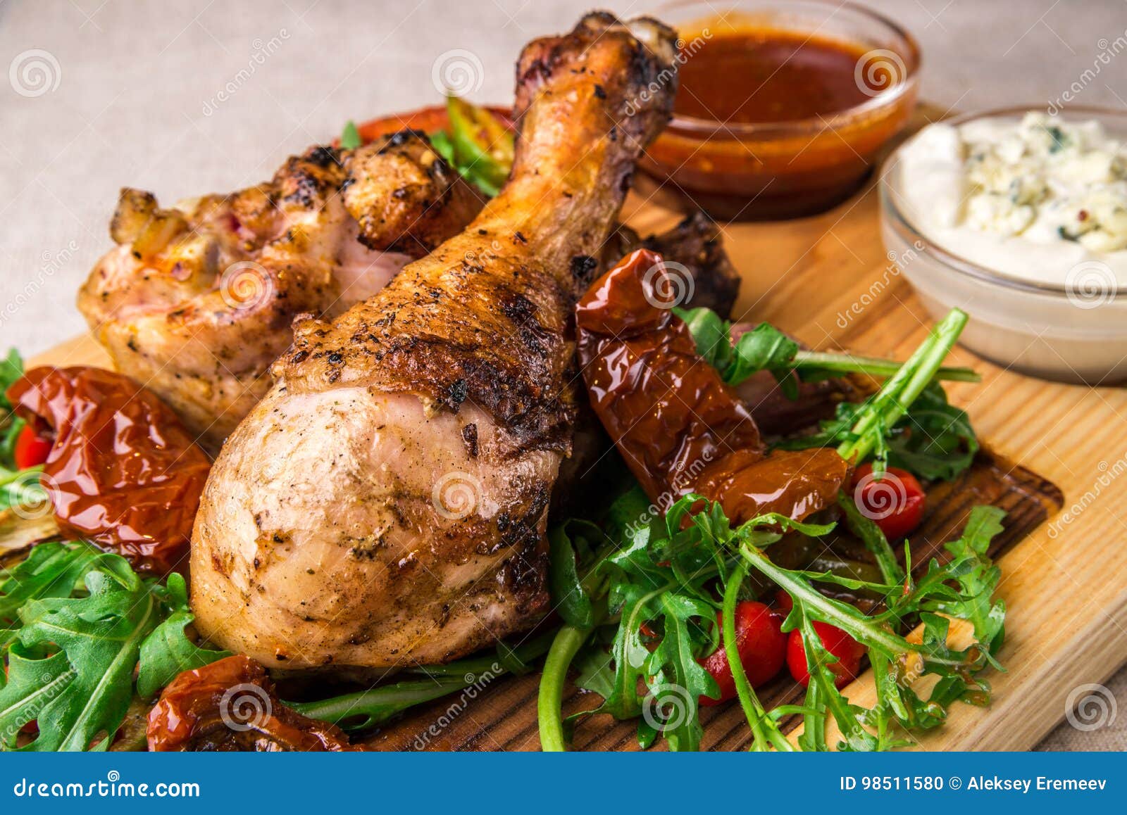 Appetizing Fried Chicken Drumsticks, Decorated with Herbs, with Sauces ...