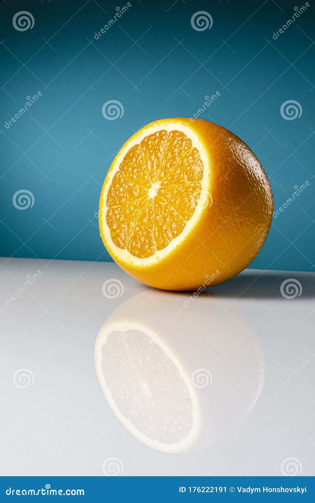 Appetizing Orange, with Reflection on a Blue Background Stock Image ...
