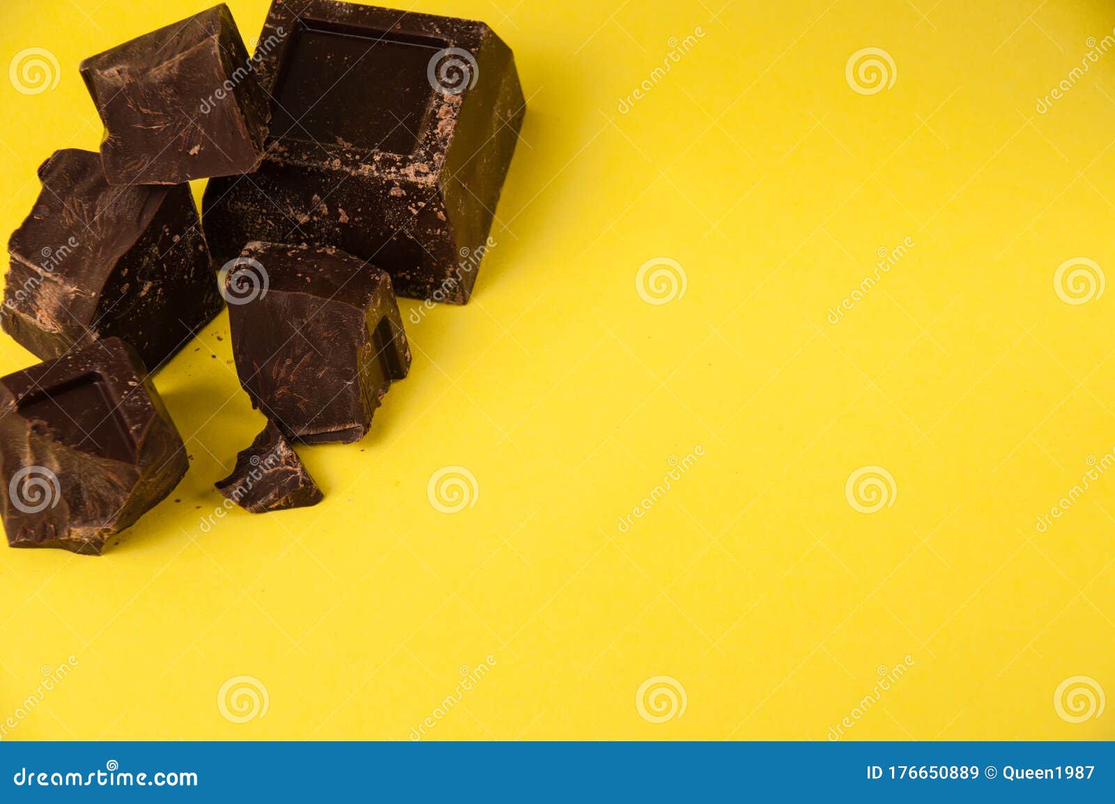 Appetizing Pieces of Black Chocolate Isolate on a Yellow Background ...