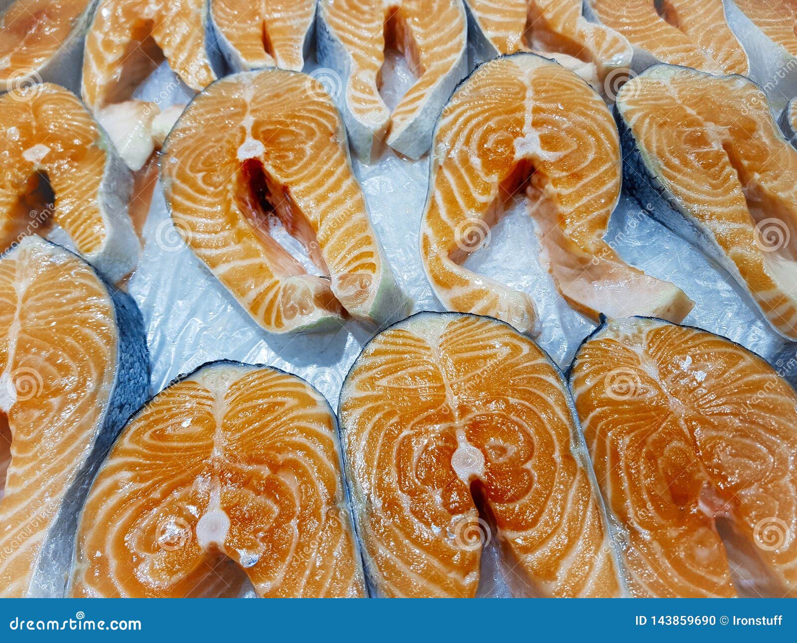 Appetizing raw fish steaks stock photo. Image of kitchen - 143859690