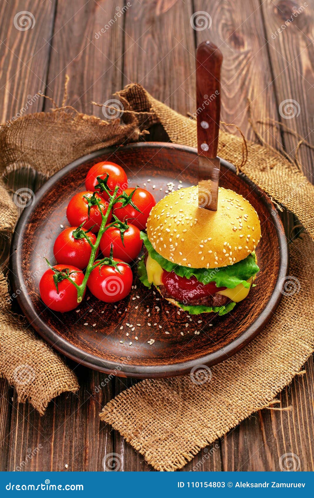 Appetizing Burger with Tomatoes on Table Stock Image - Image of ketchup ...