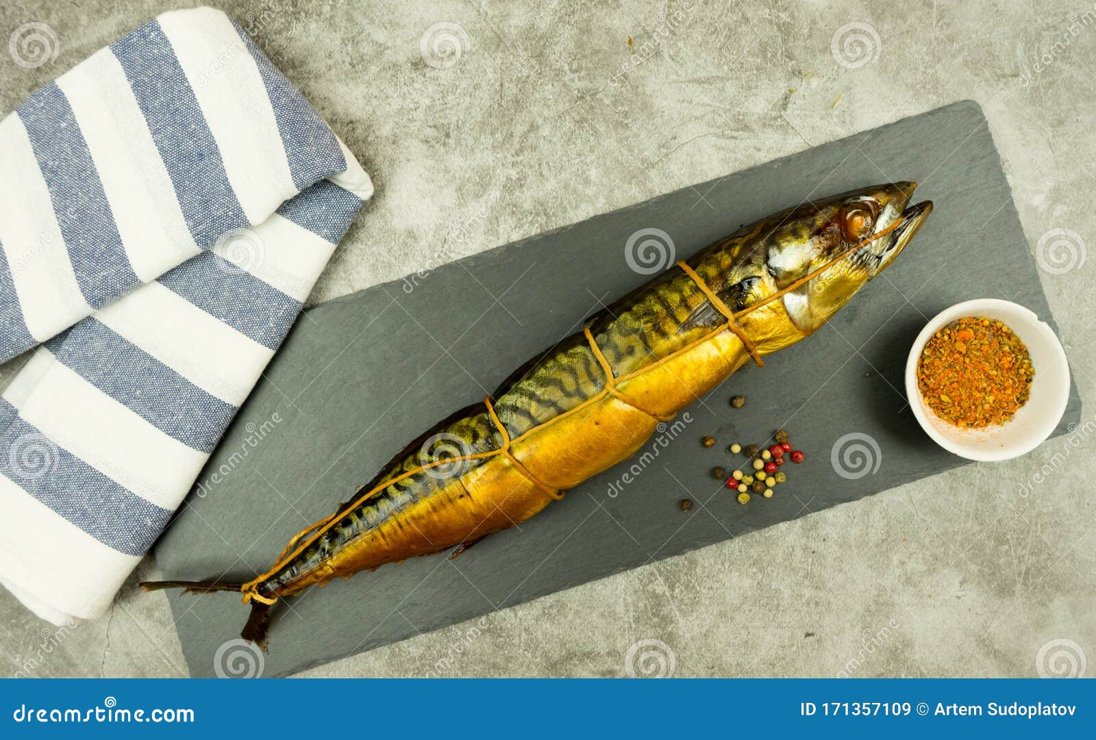 Appetizing Smoked Fish on Kitchen Board.Smoked Fish with Spices Stock ...
