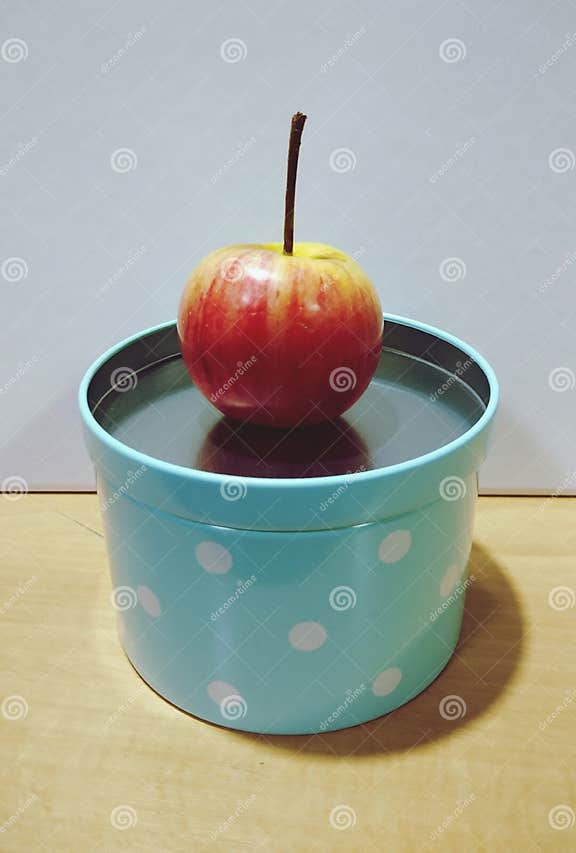 An apple on a blue box stock photo. Image of blue, apple - 255891250