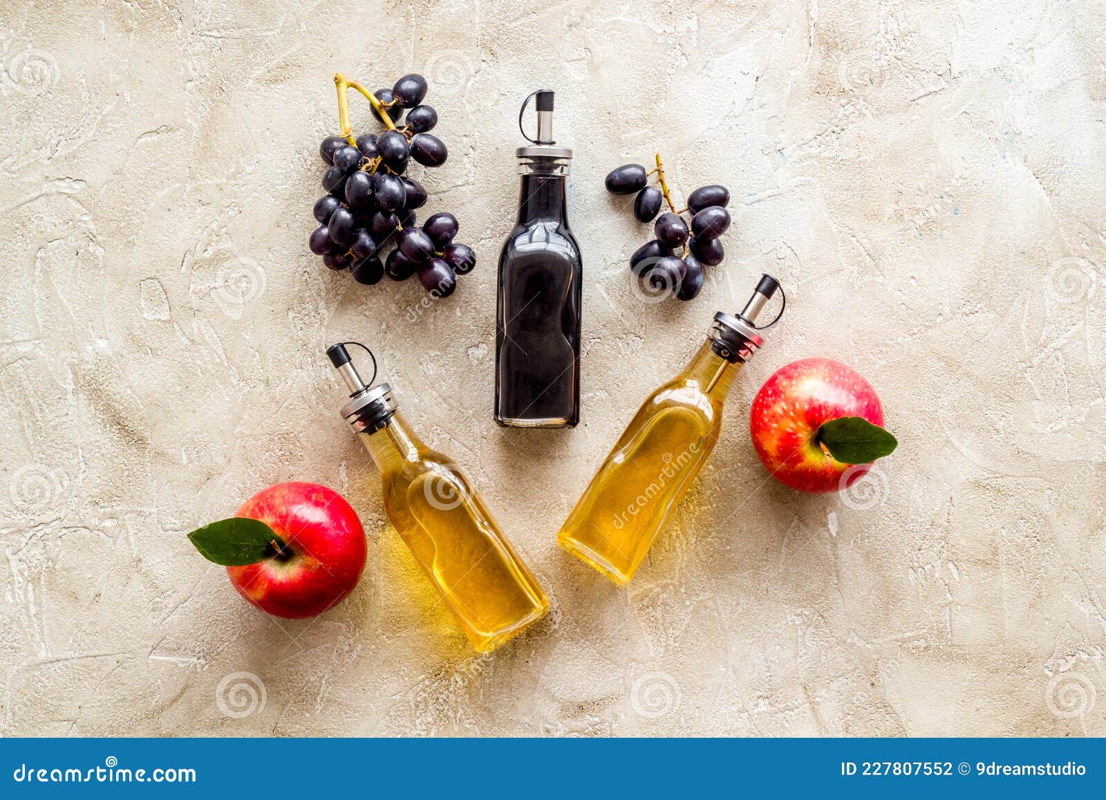 Apple Cider and Balsamic Vinegar in Bottles with Grapes and Red Apples ...
