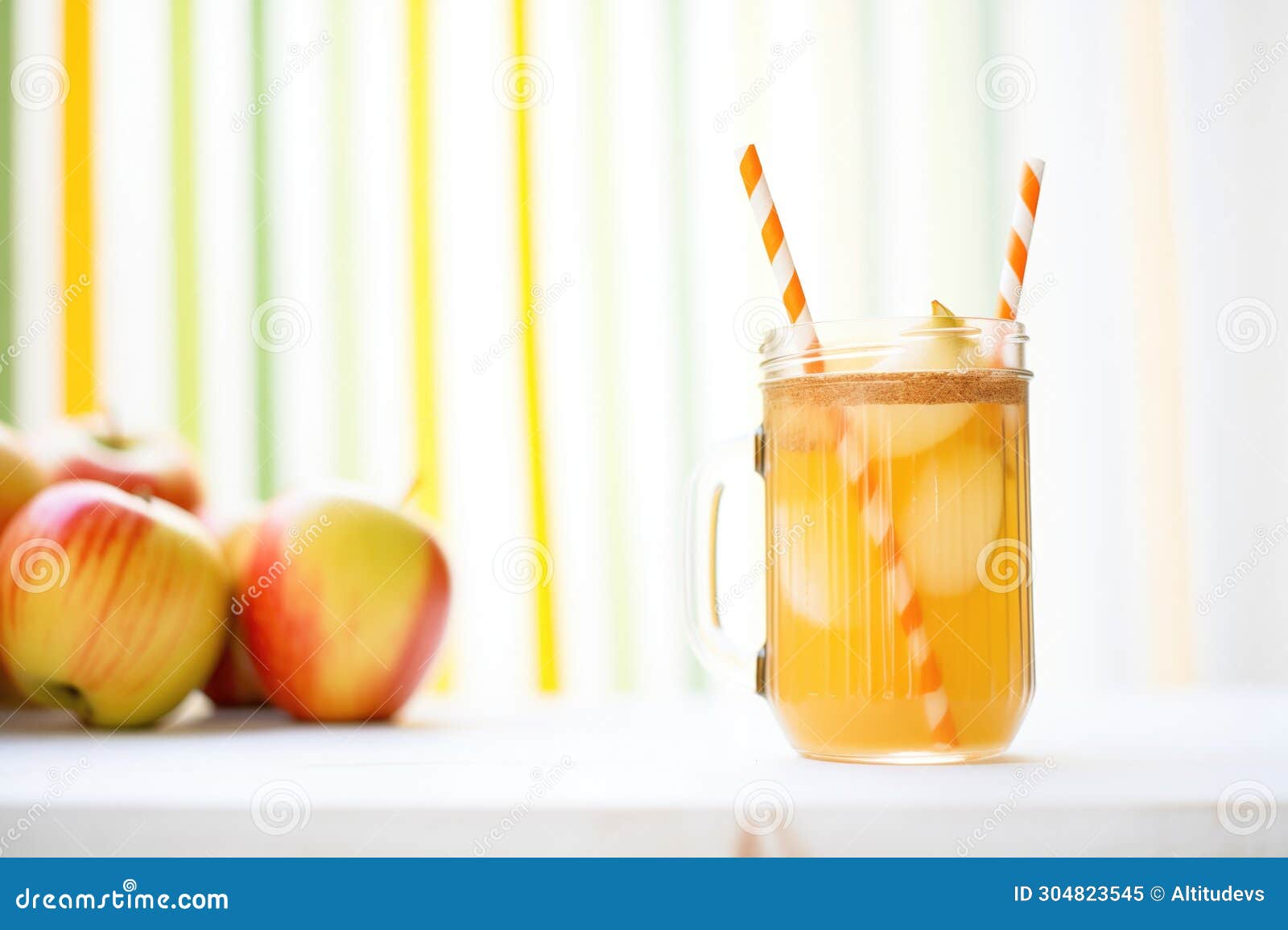 Apple Cider in Clear Glass with a Striped Straw Stock Image - Image of ...