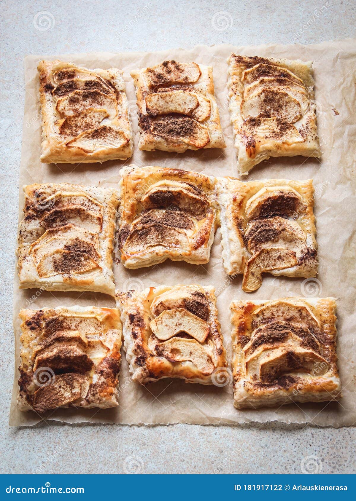 Apple and Cinnamon Puff Pastries on a Baking Paper Flat Lay Stock Photo ...