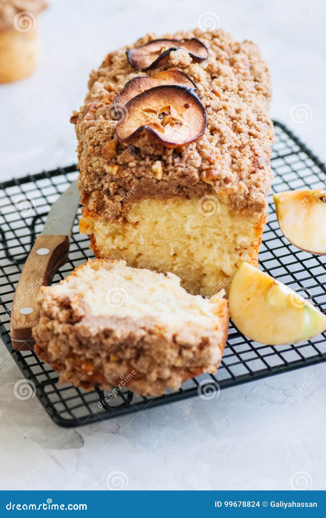 Apple Cinnamon Streusel Cake on a Wire Rack on a White Stone Background ...