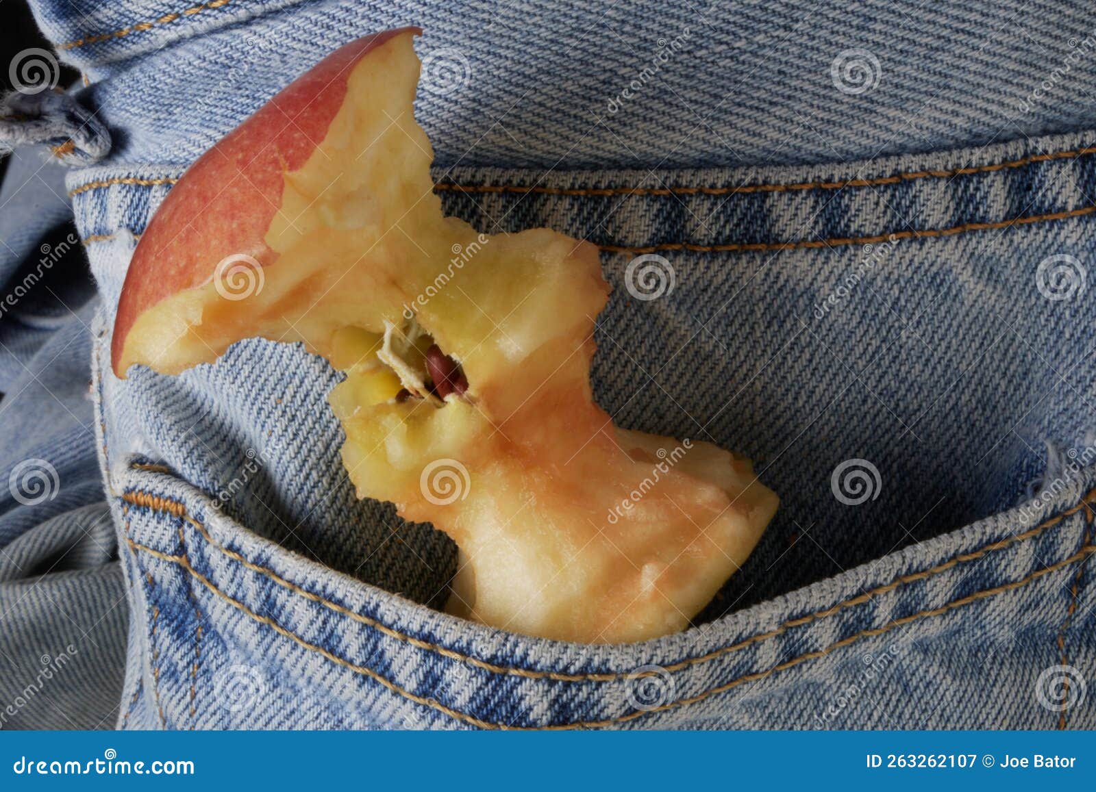 Apple Core Sticking Out from Pants Pocket Stock Image - Image of core ...