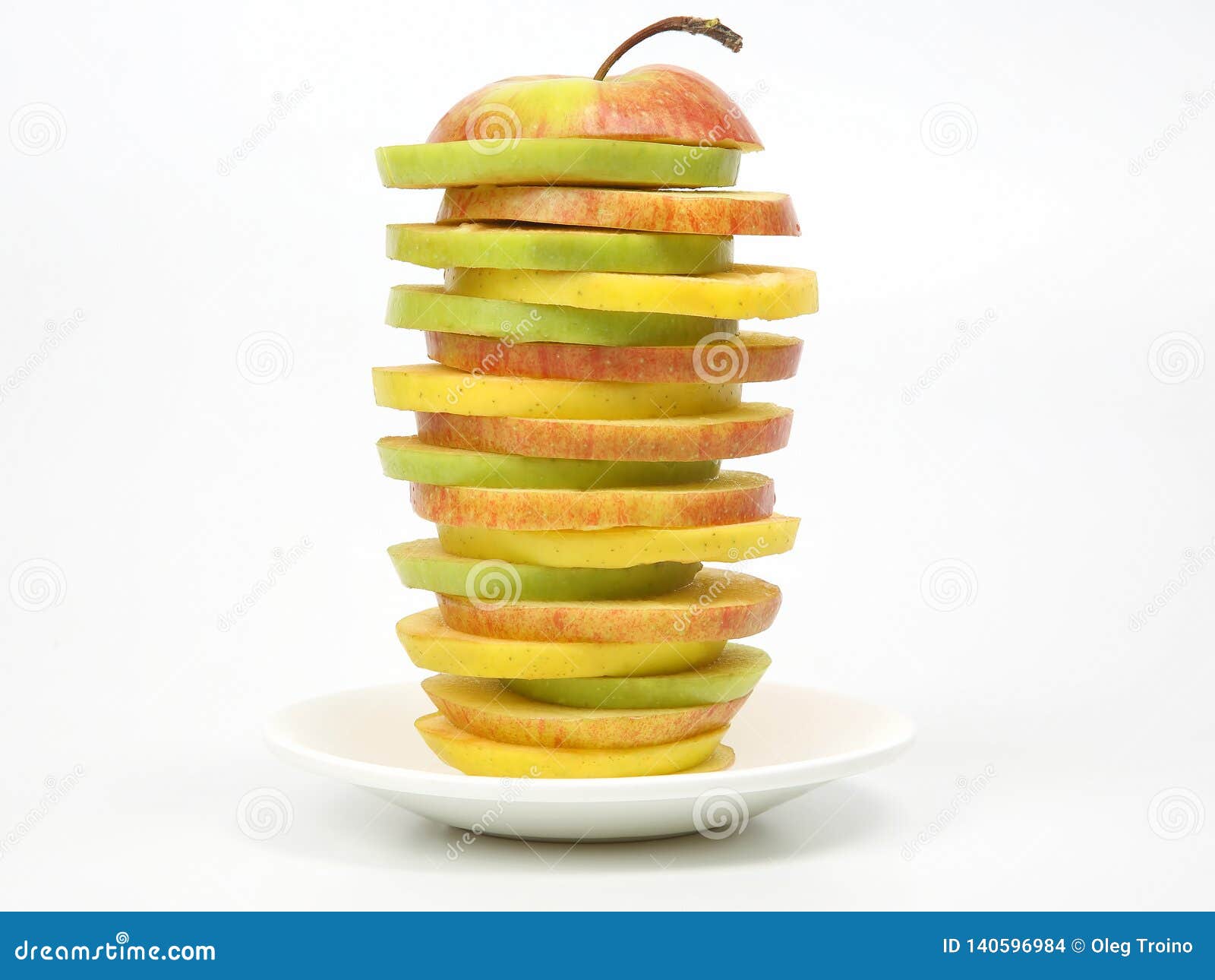 Apple Cut into Pieces on a White Plate Stock Photo - Image of breakfast ...
