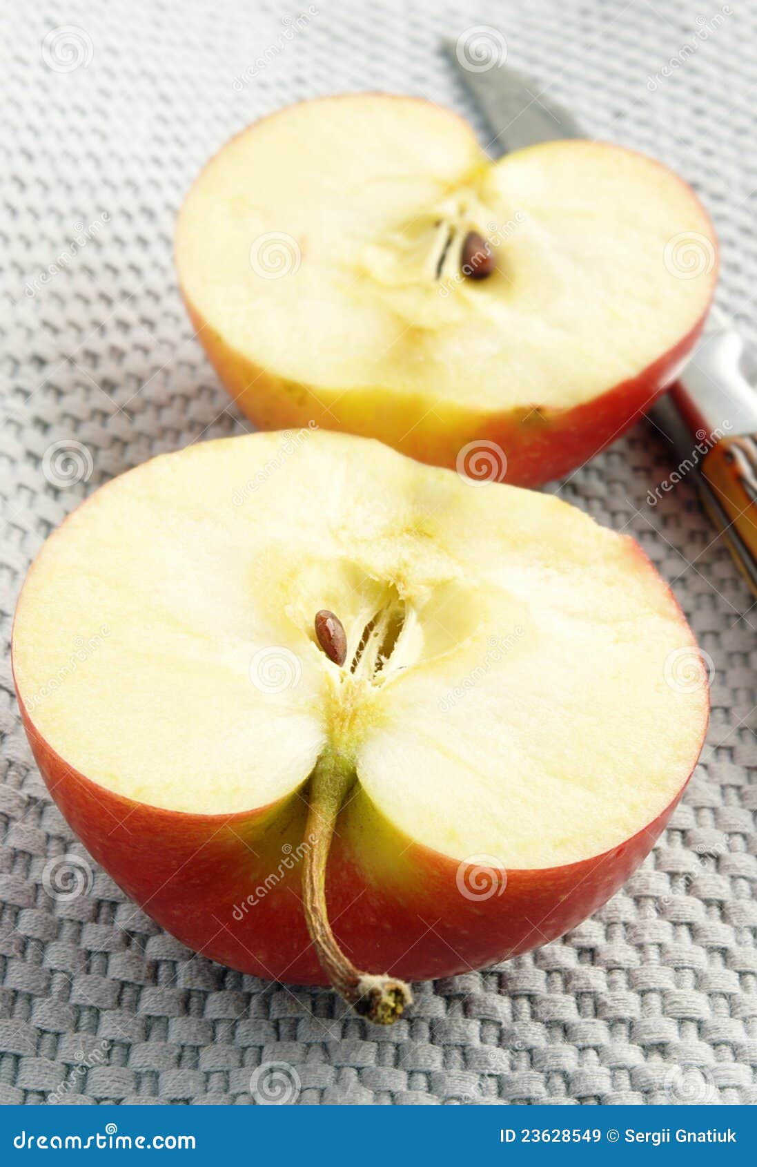 Apple Cut Into Two Pieces Royalty Free Stock Images - Image: 23628549