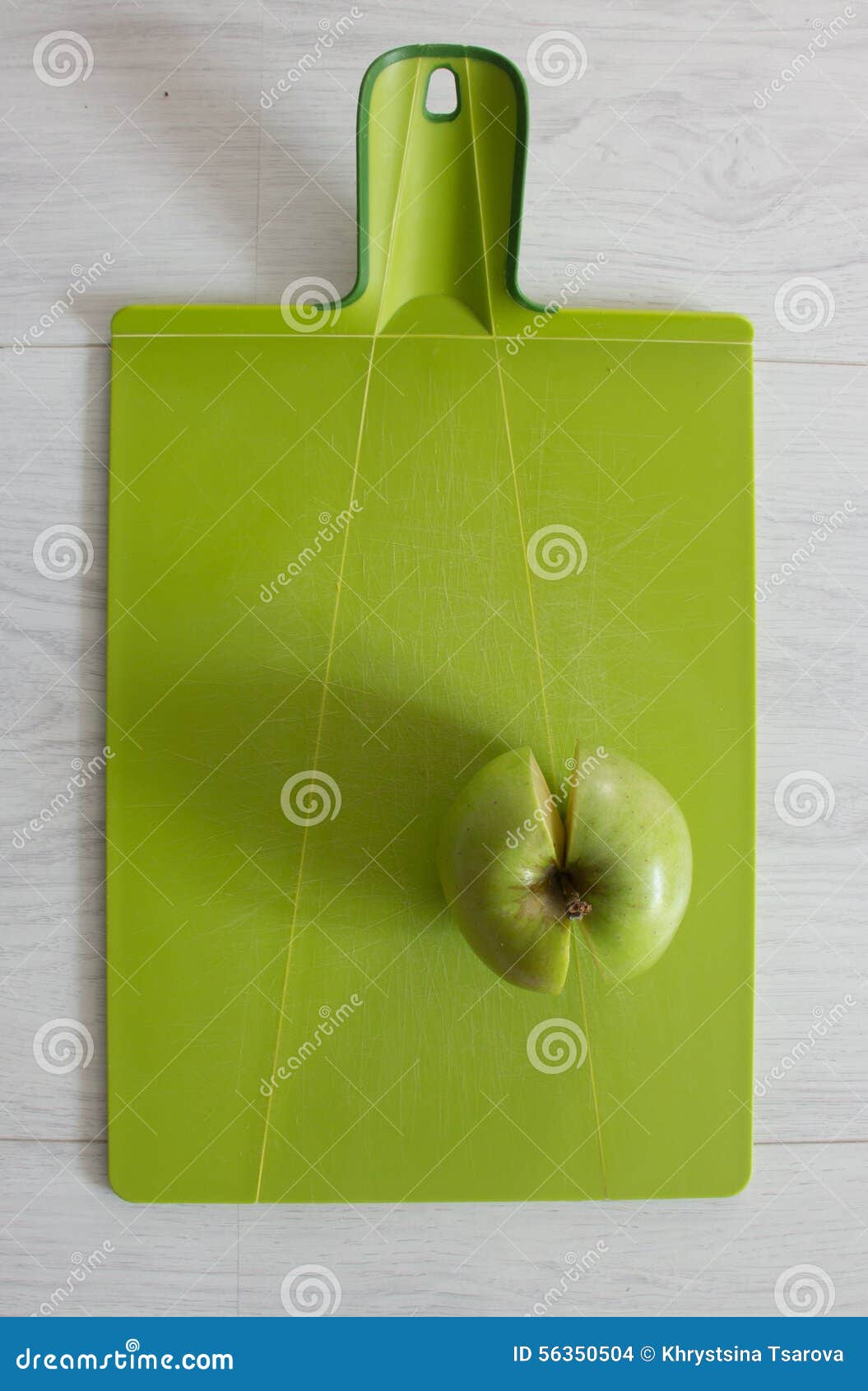 Apple on a cutting board stock photo. Image of eating - 56350504