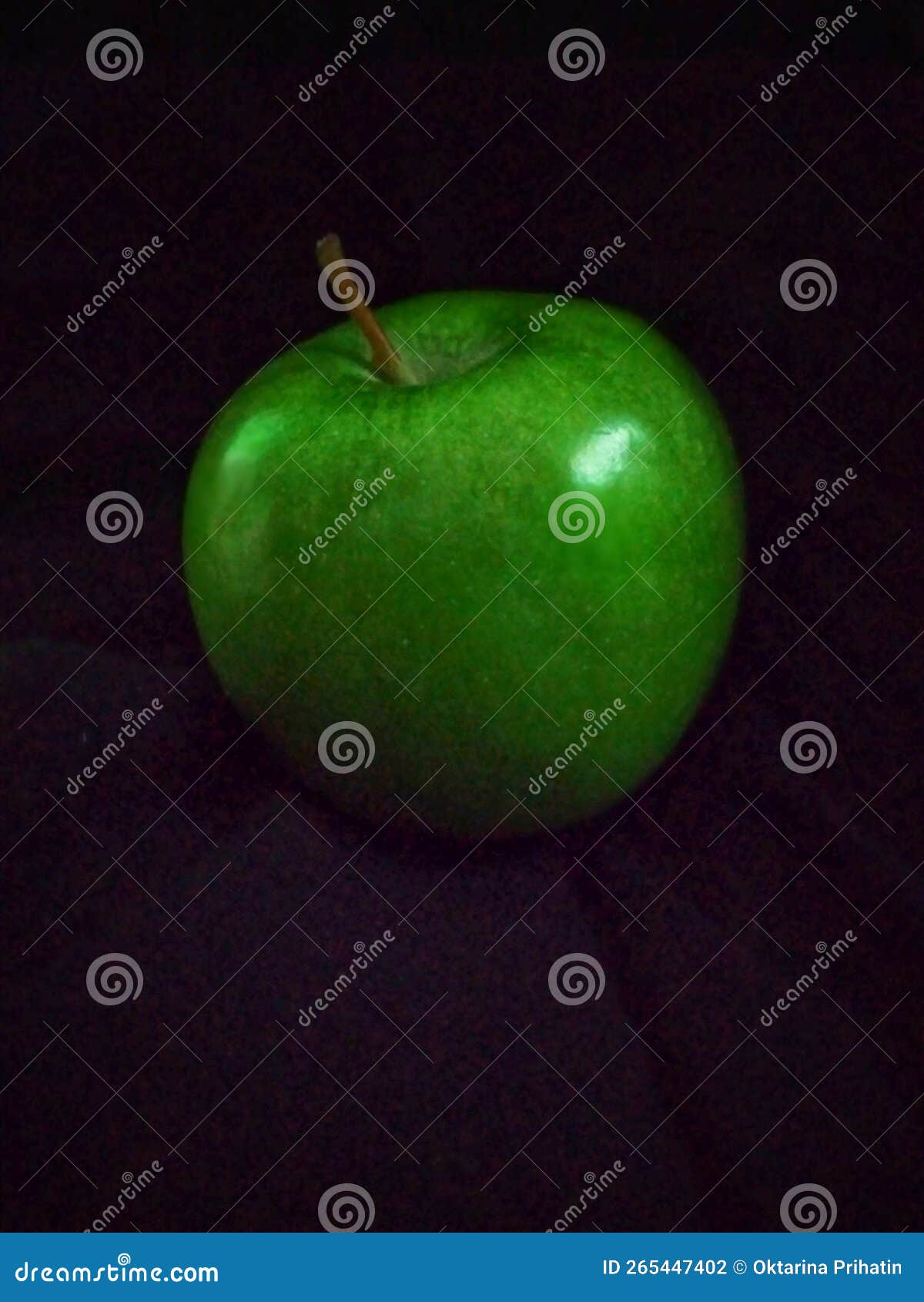 An apple in a darkness stock photo. Image of fruit, darkness - 265447402