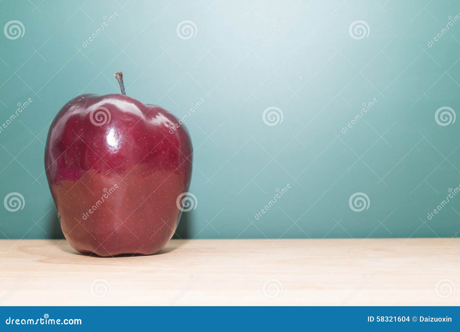 Apple on the desk stock photo. Image of college, school - 58321604