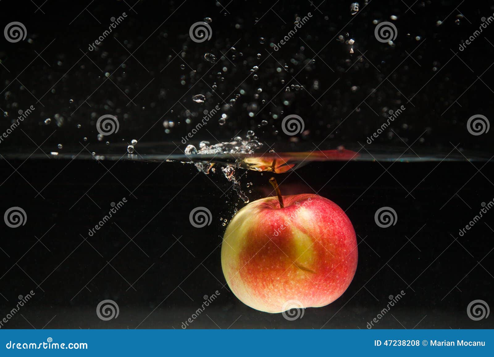 Apple falling in water stock photo. Image of nature, liquid - 47238208