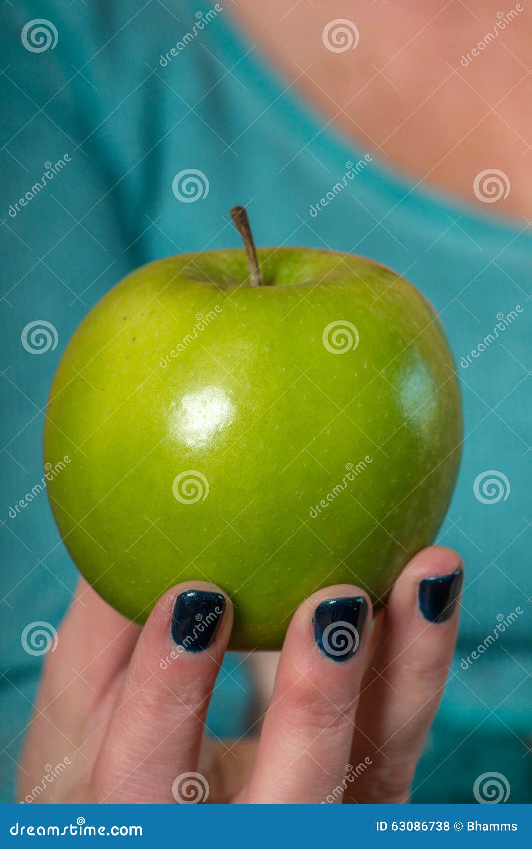 Apple on finger tips stock photo. Image of nutrition - 63086738